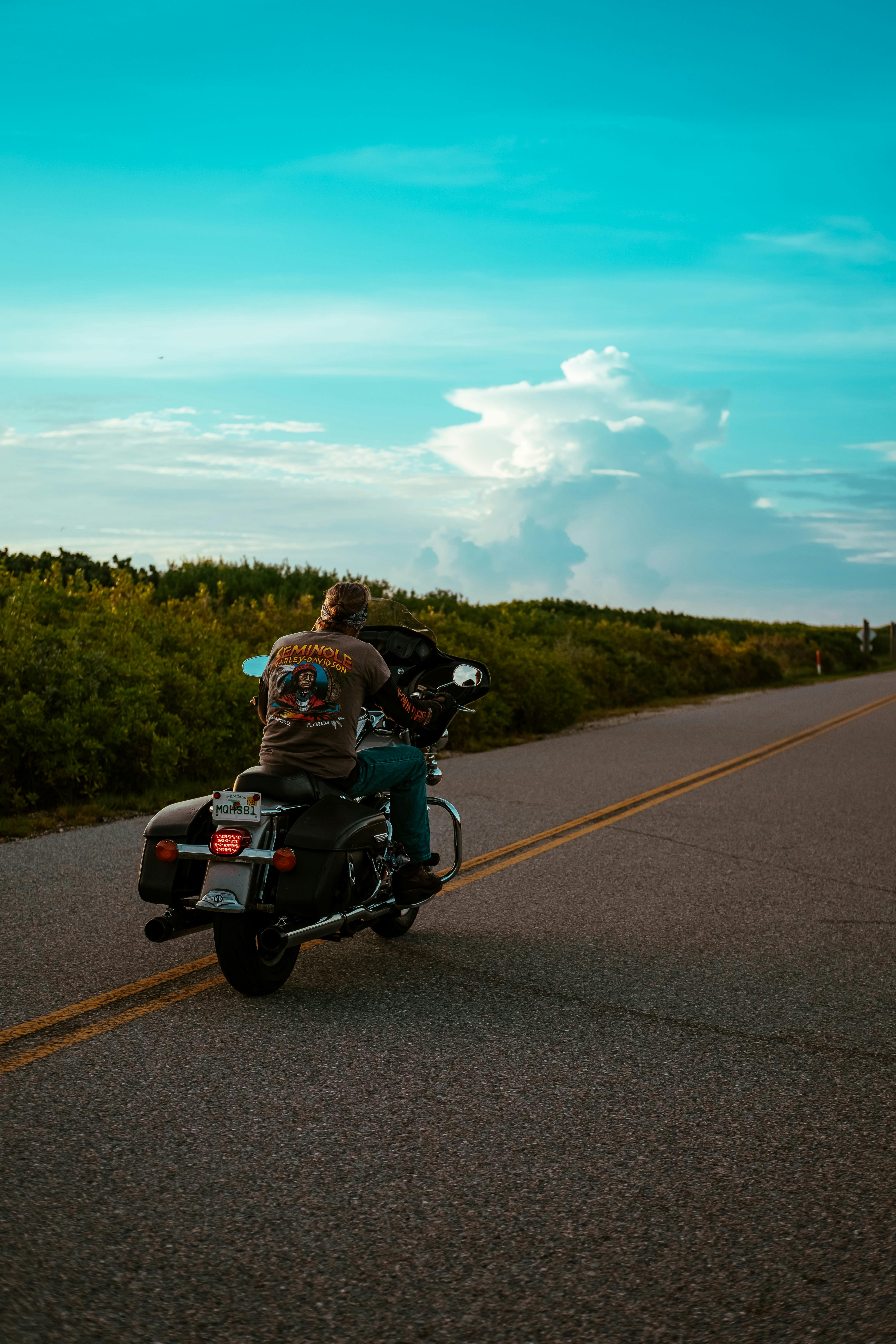 A Man Riding a Motorcycle · Free Stock Photo