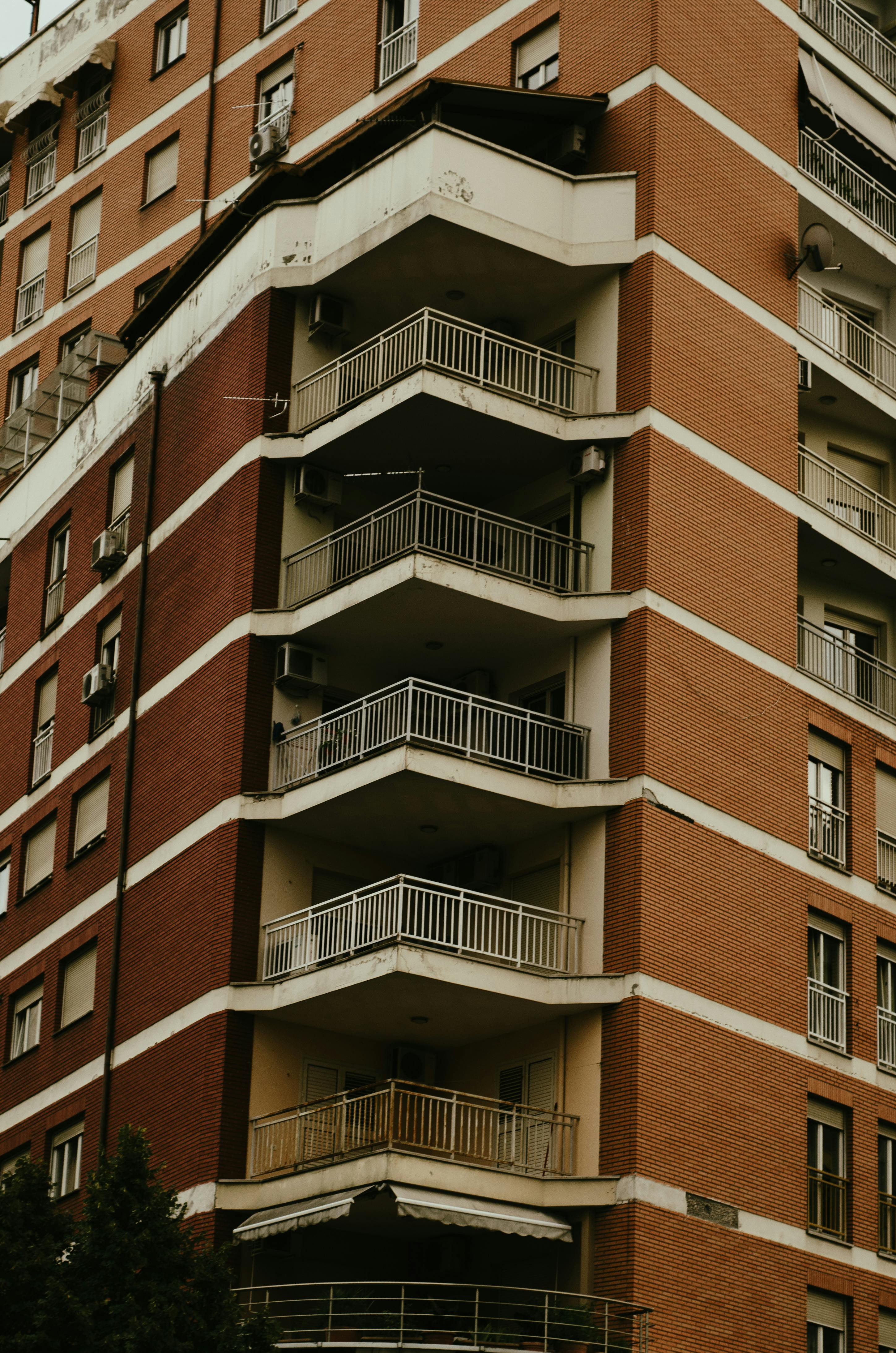 Photo of a Balcony of a Brick Building · Free Stock Photo