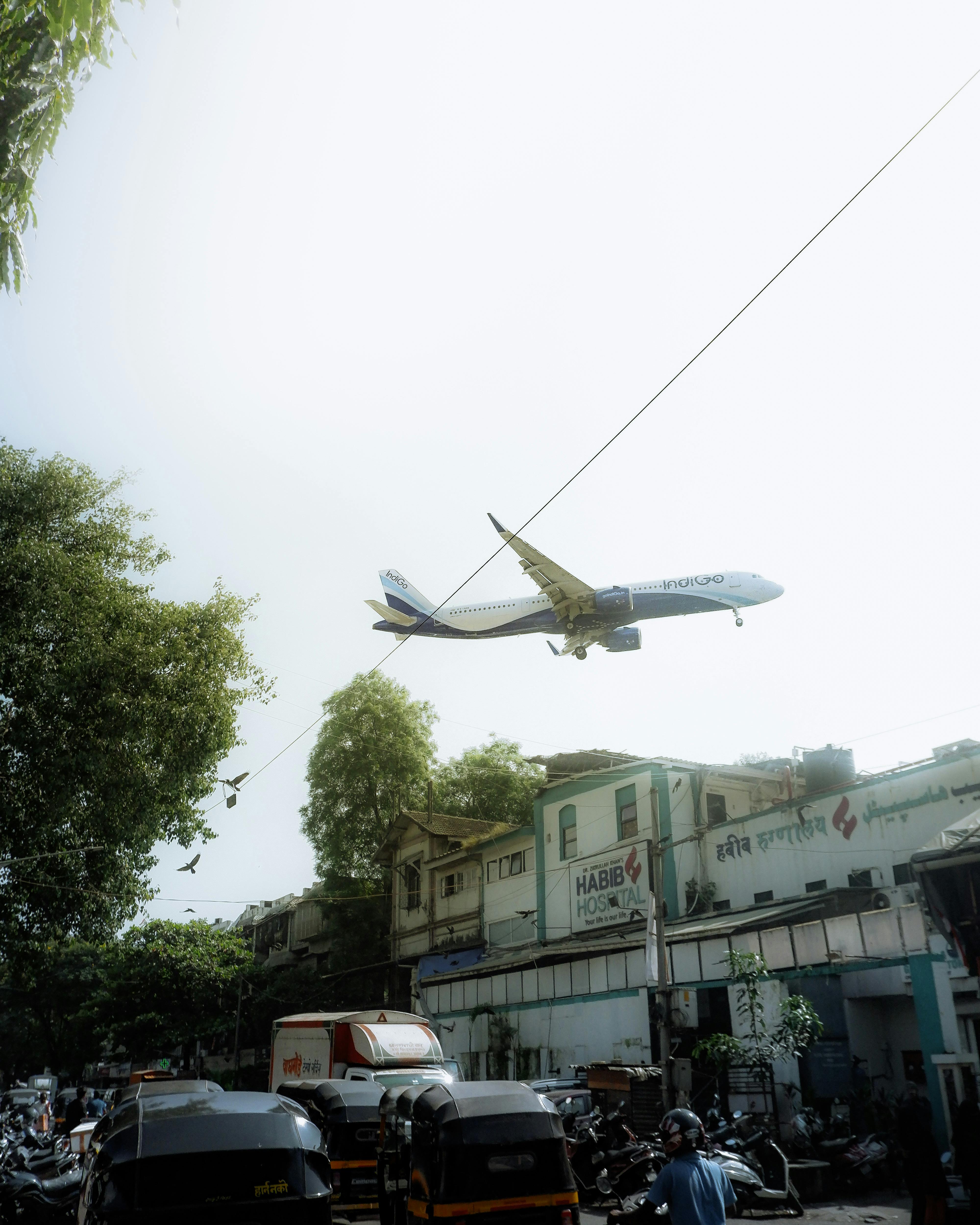 Airplane over a Busy Street · Free Stock Photo
