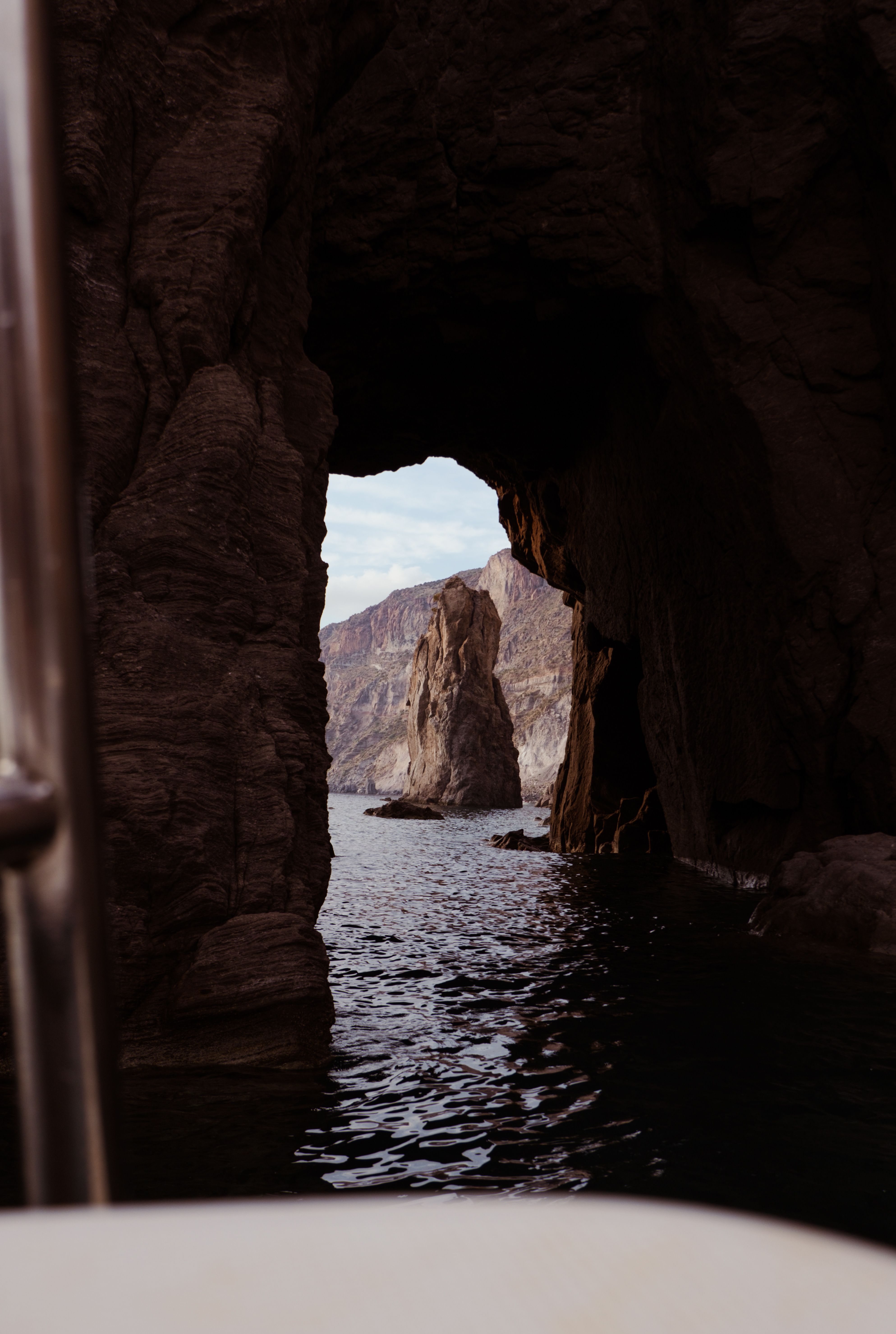 Brown Rock Formation on Body of Water · Free Stock Photo