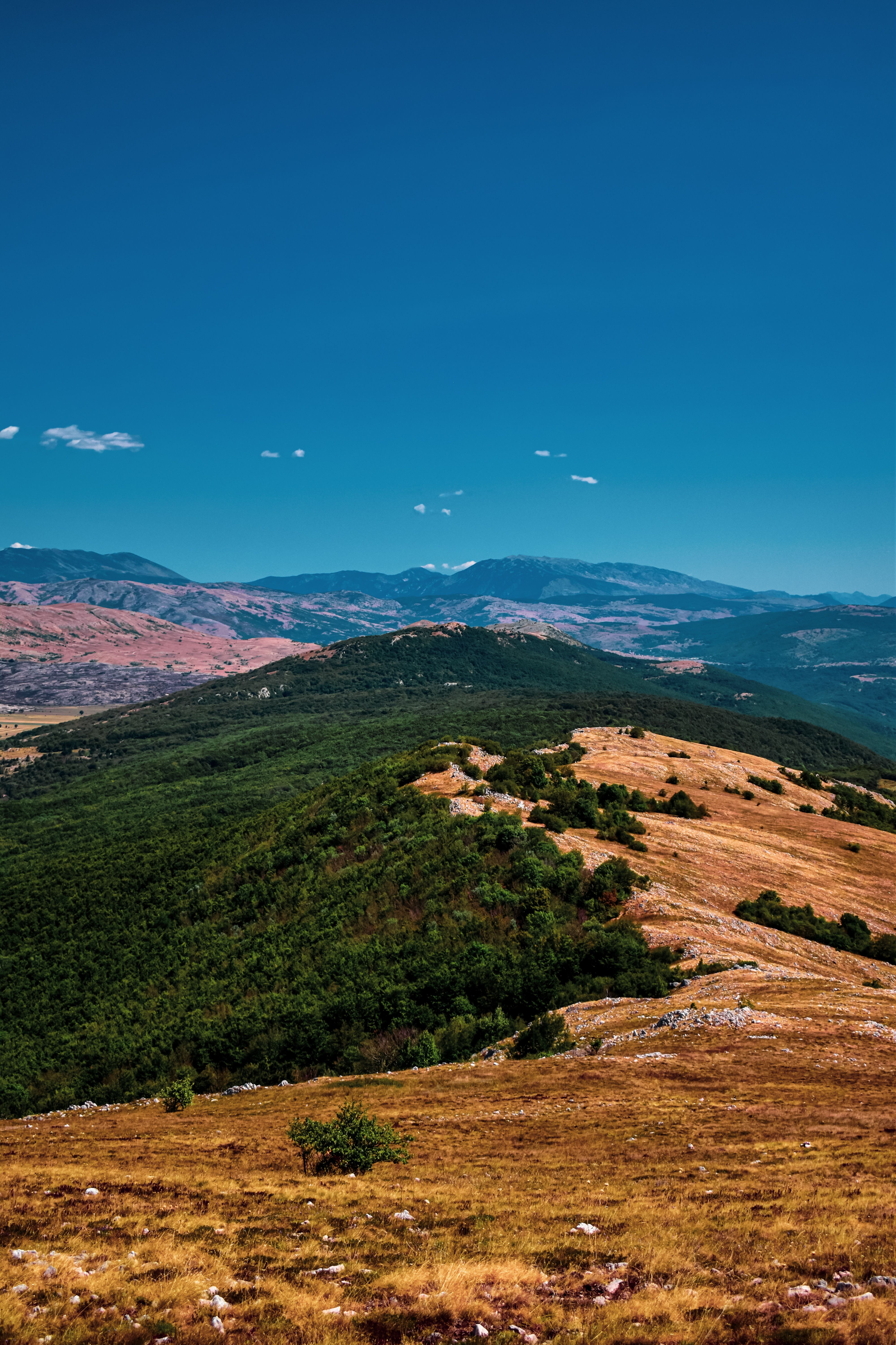 Landscape Scenery of Hill Across the Blue Sky · Free Stock Photo