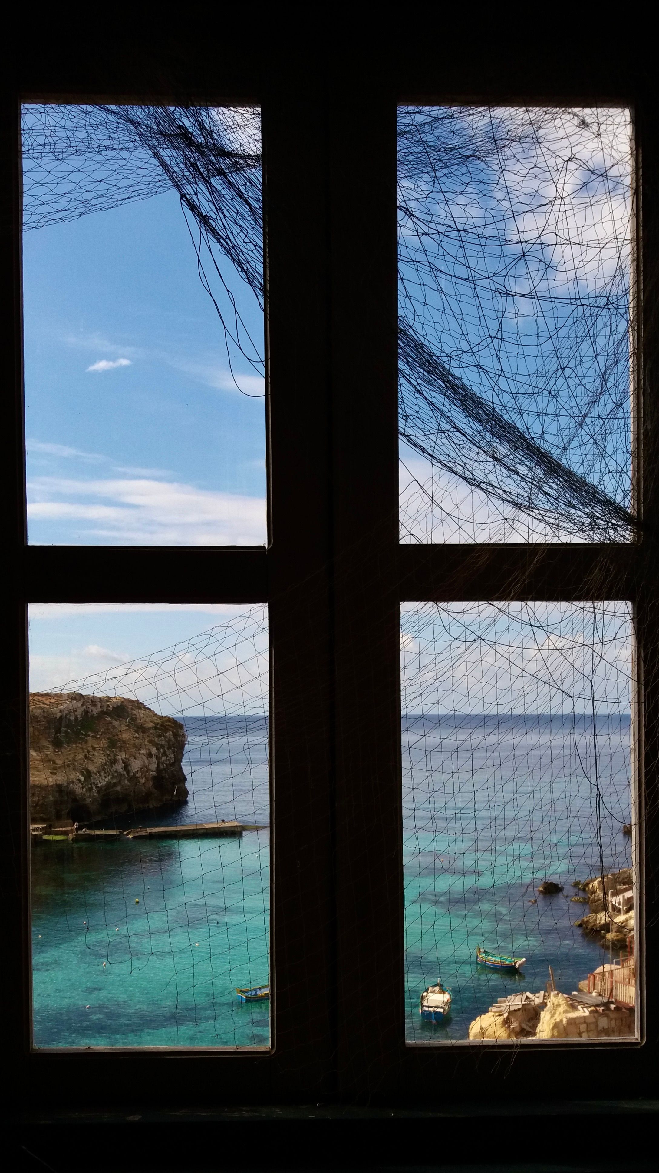 A Scenic View of the Sea From a Window · Free Stock Photo