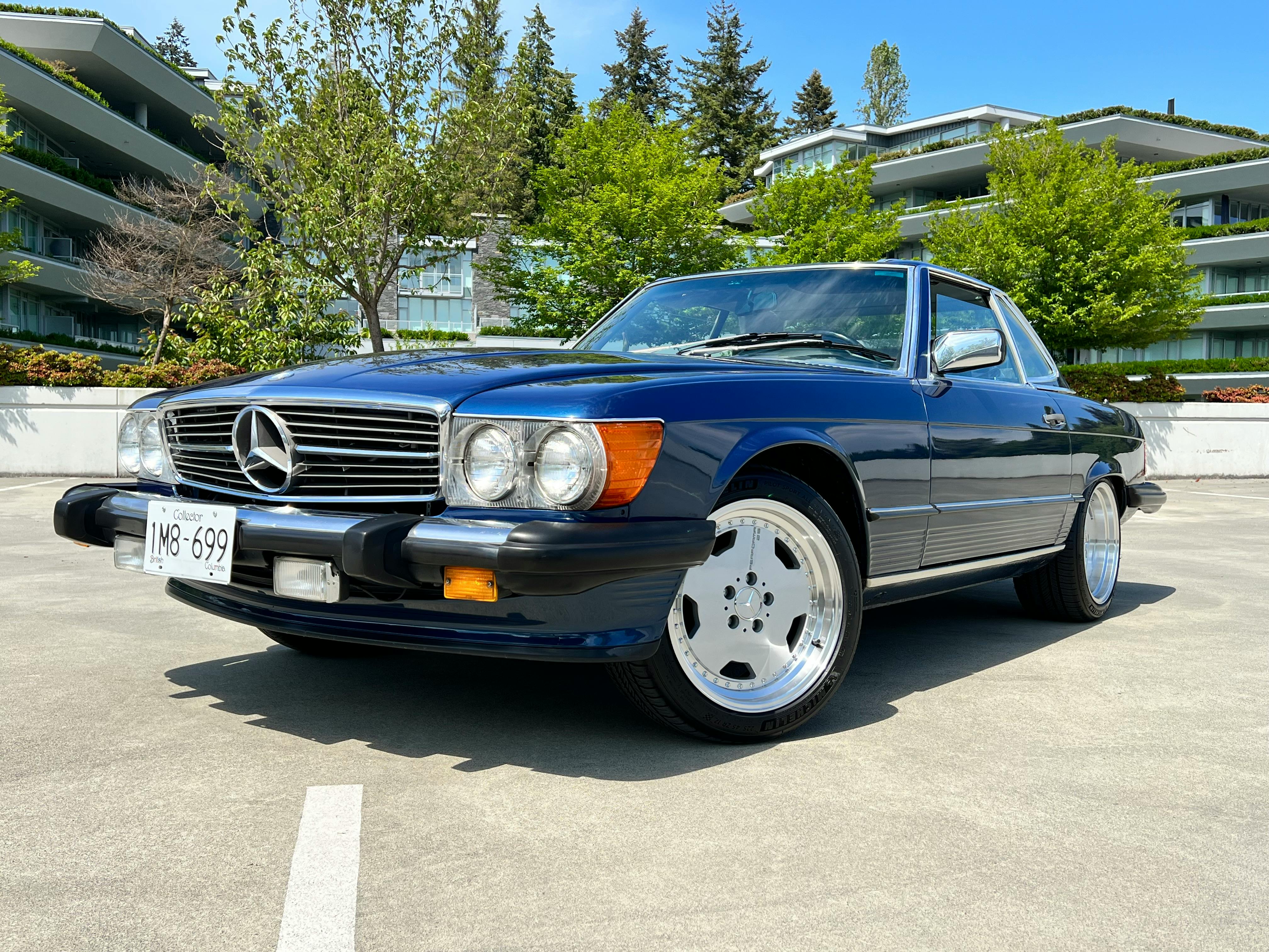 A Blue Mercedes Benz Parked on the Street · Free Stock Photo