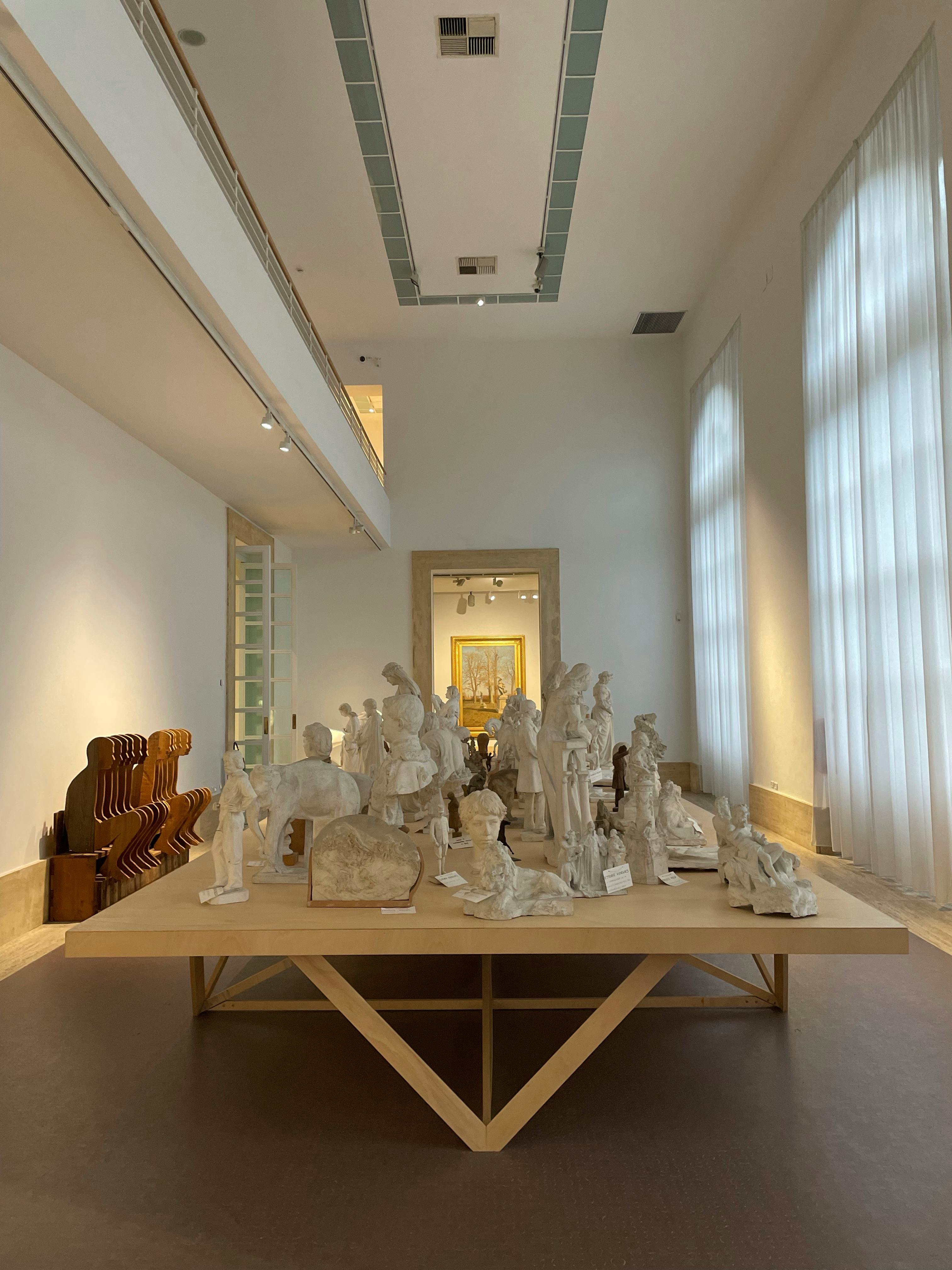 Sculptures on Table in Museum · Free Stock Photo