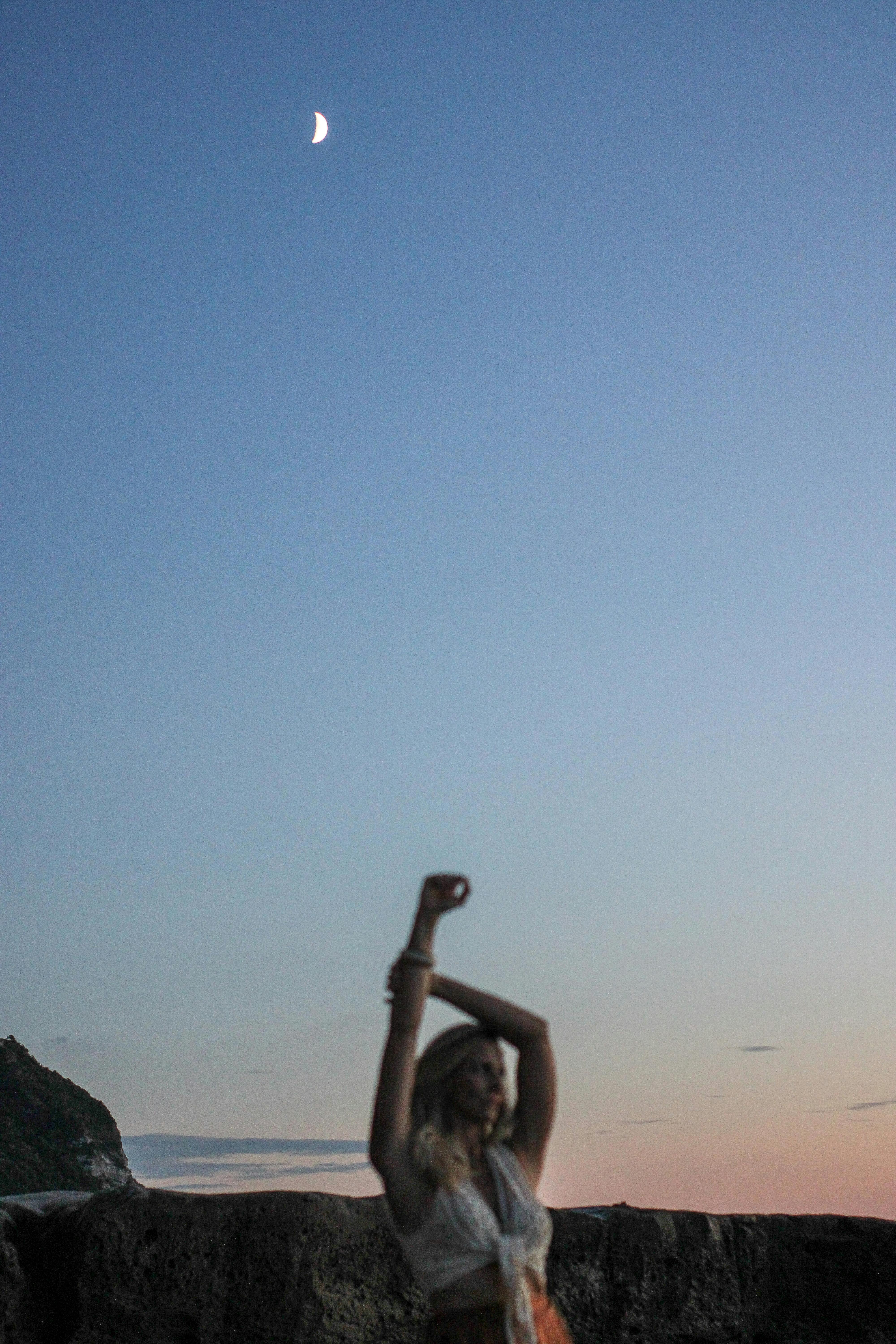 Woman Standing with Raised Hand · Free Stock Photo