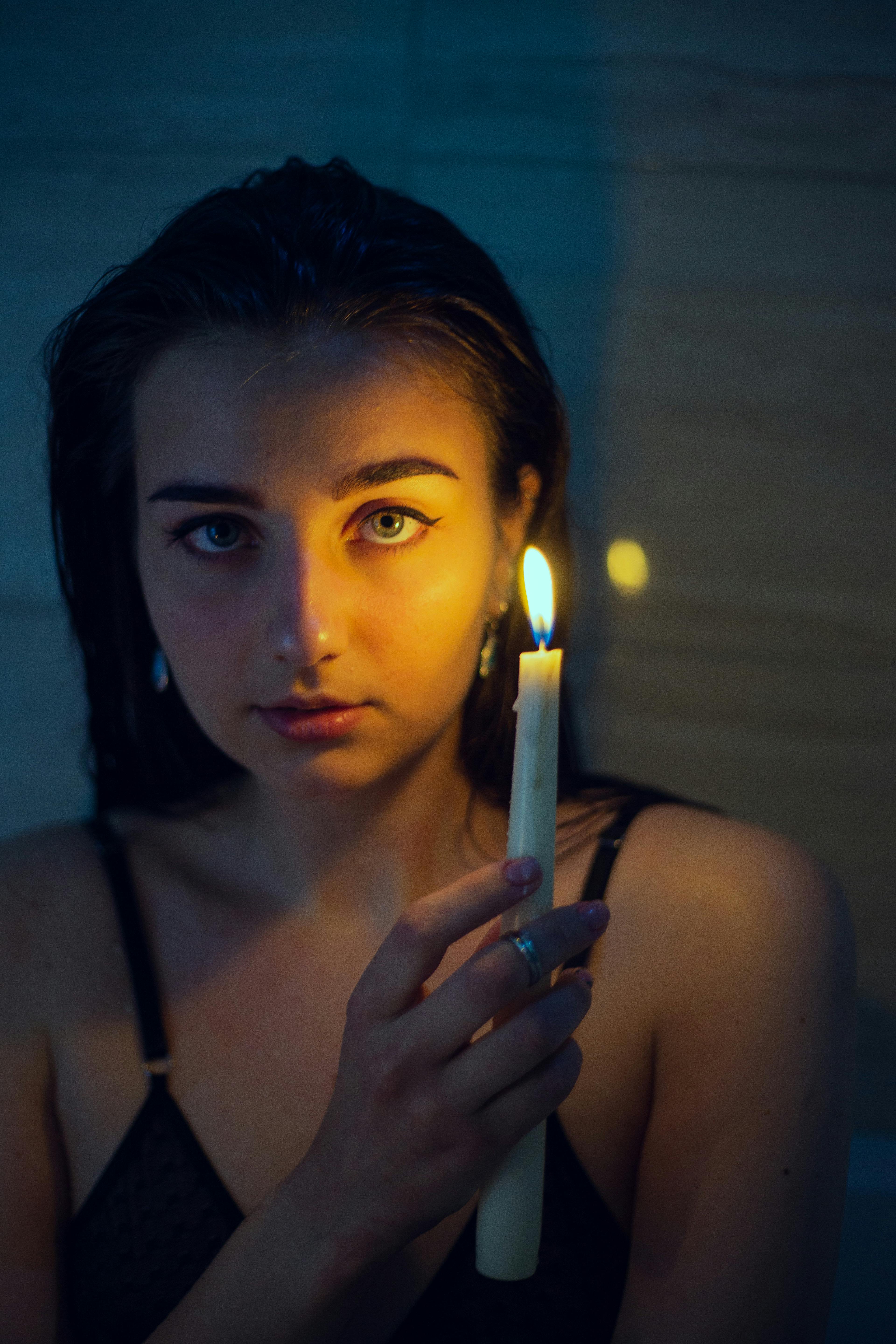 Portrait of Brunette Woman with Candle · Free Stock Photo