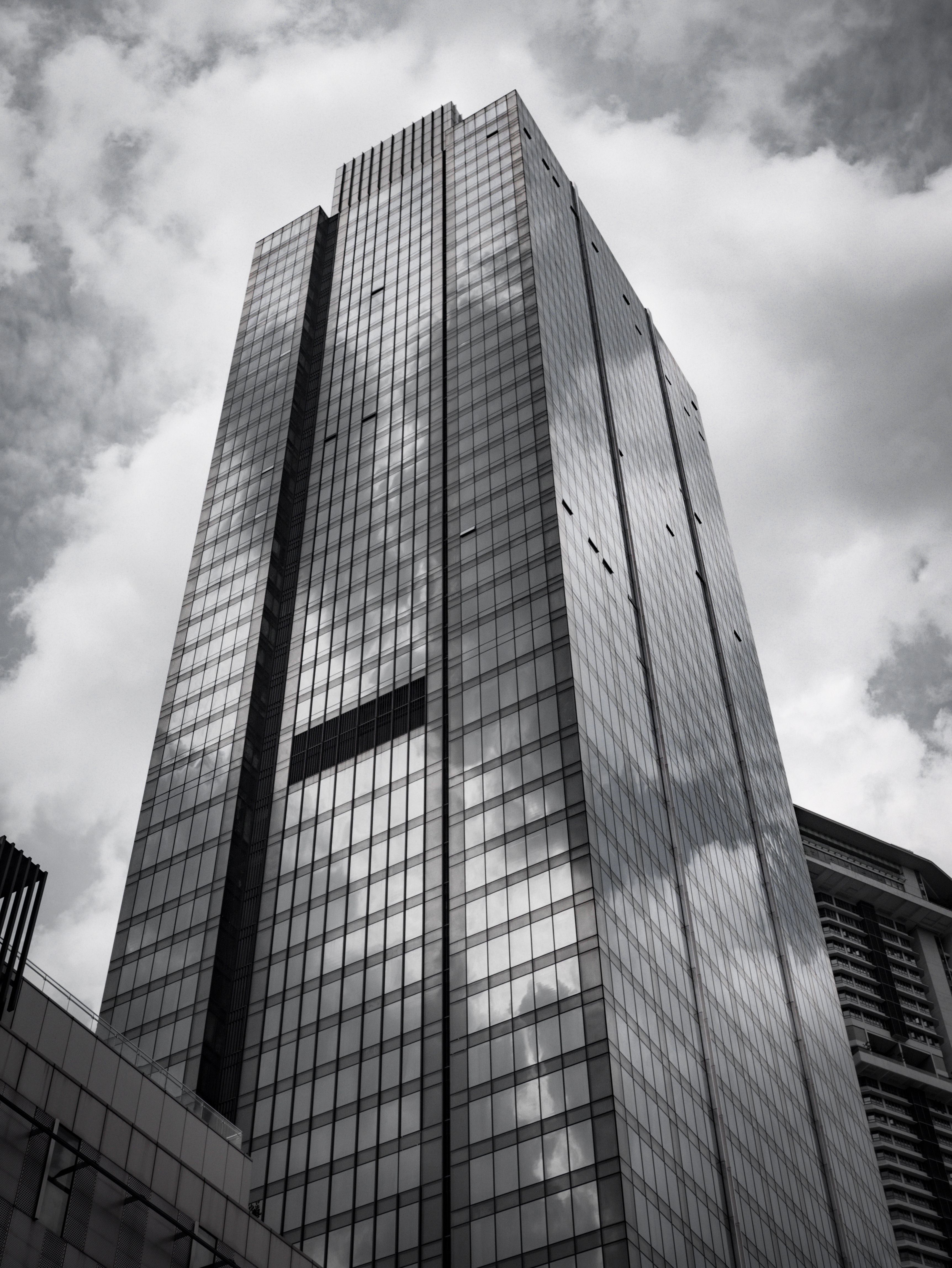 Low Angle View of Skyscrapers Against Cloudy Sky · Free Stock Photo