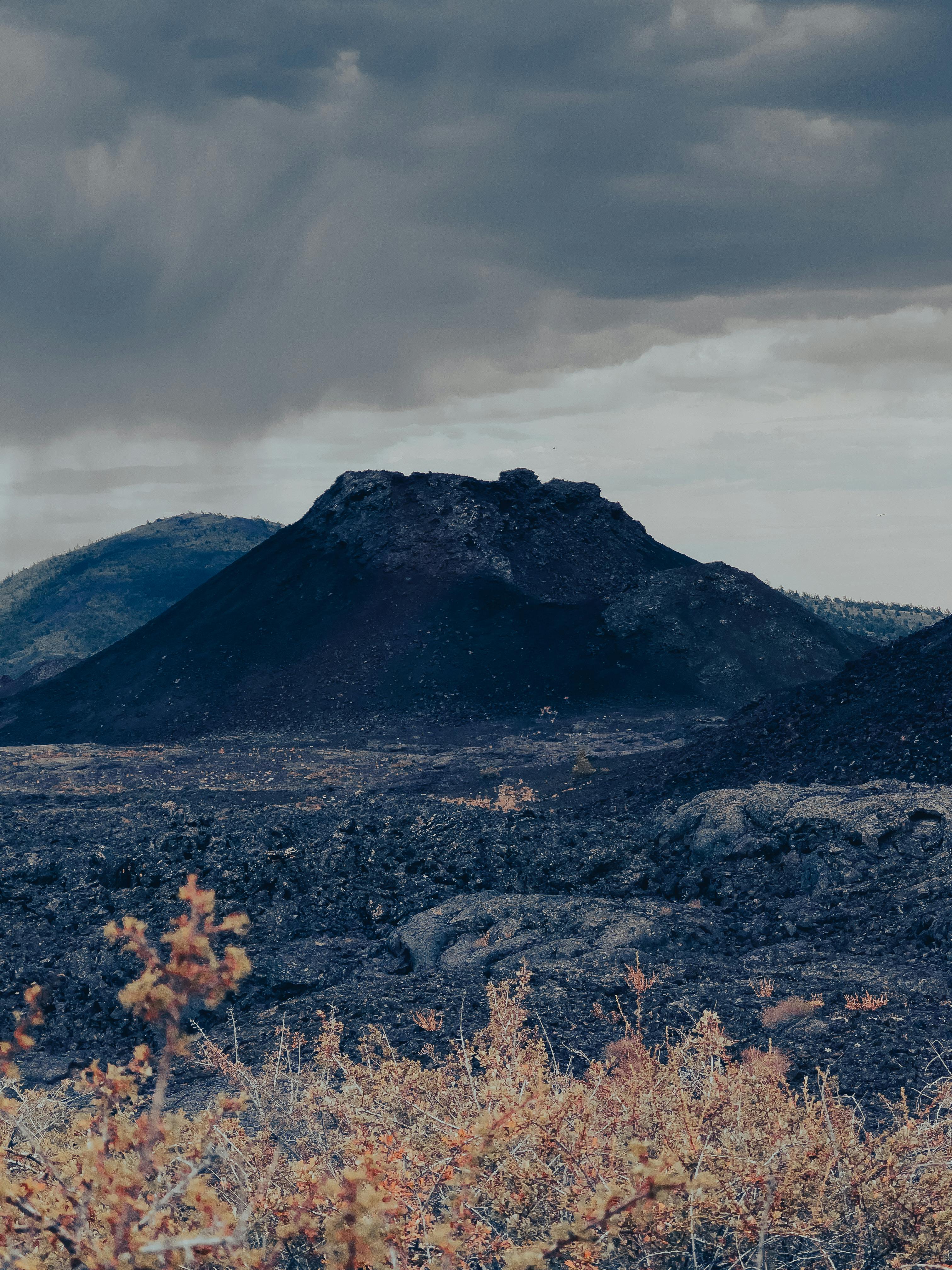 Gray Concrete Mountain under Blue Sky and White Clouds · Free Stock Photo