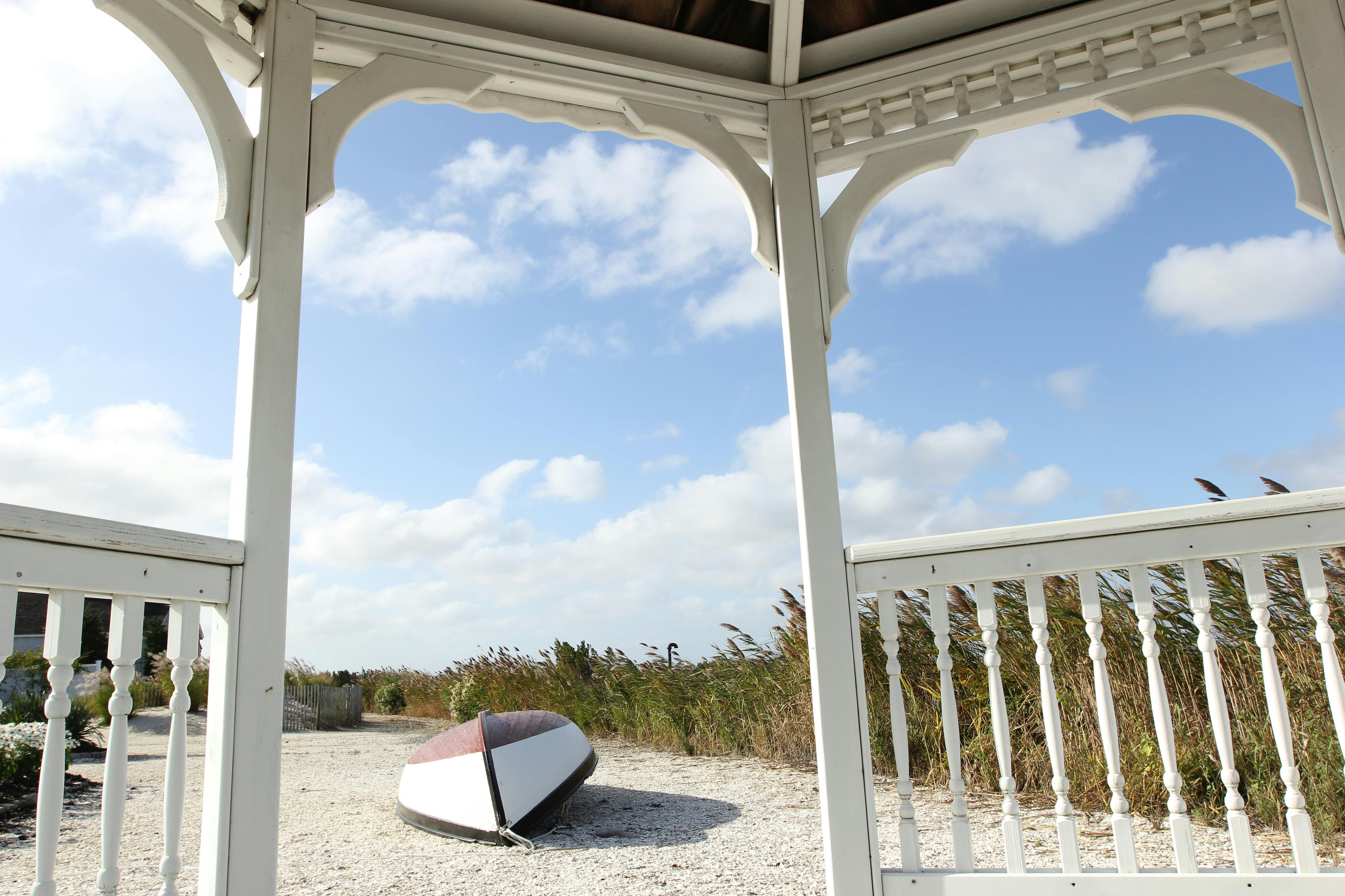 Photo of Boat near a Gazebo · Free Stock Photo