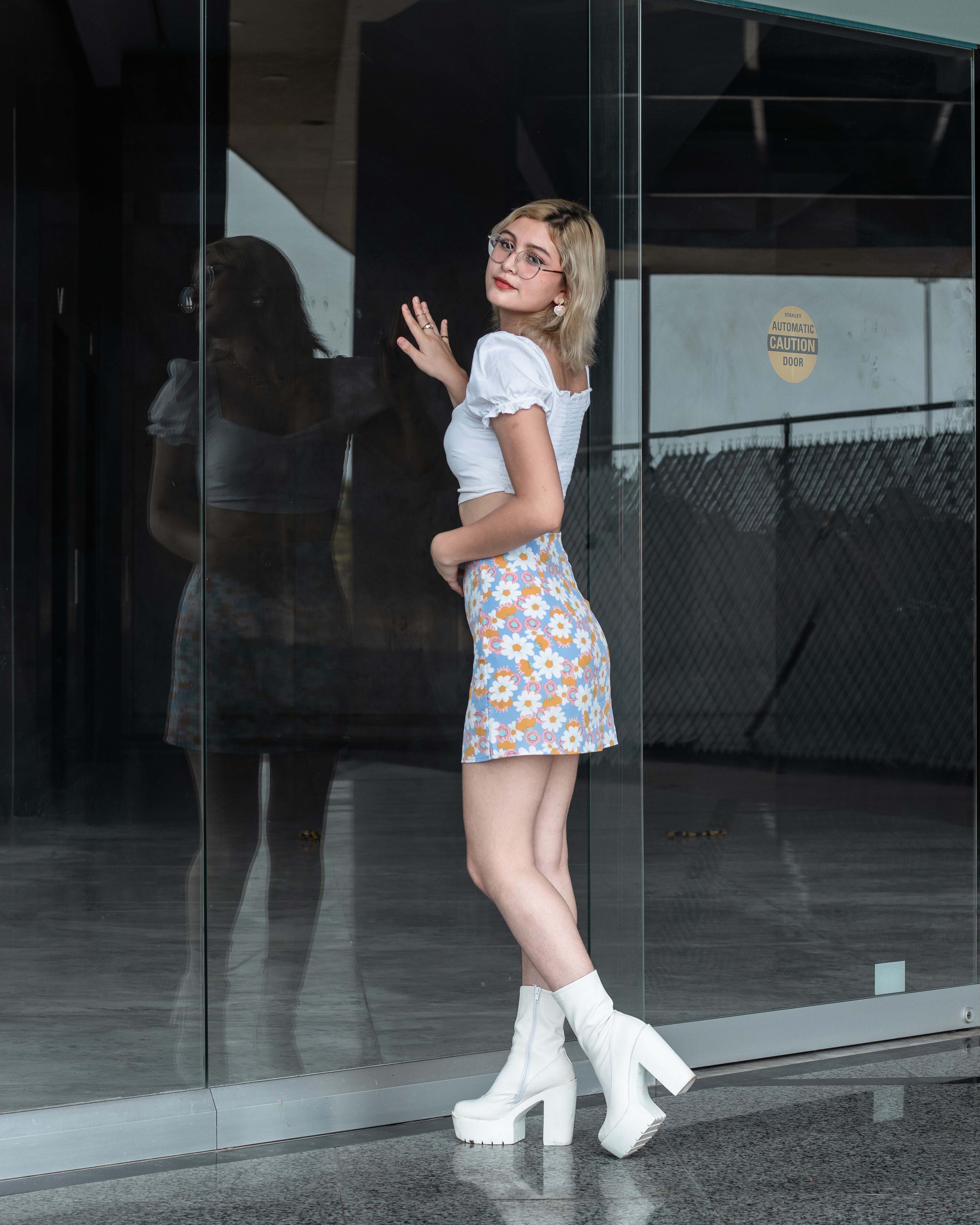 Woman in White Crop Top and Blue and Orange Floral Skirt Standing ...
