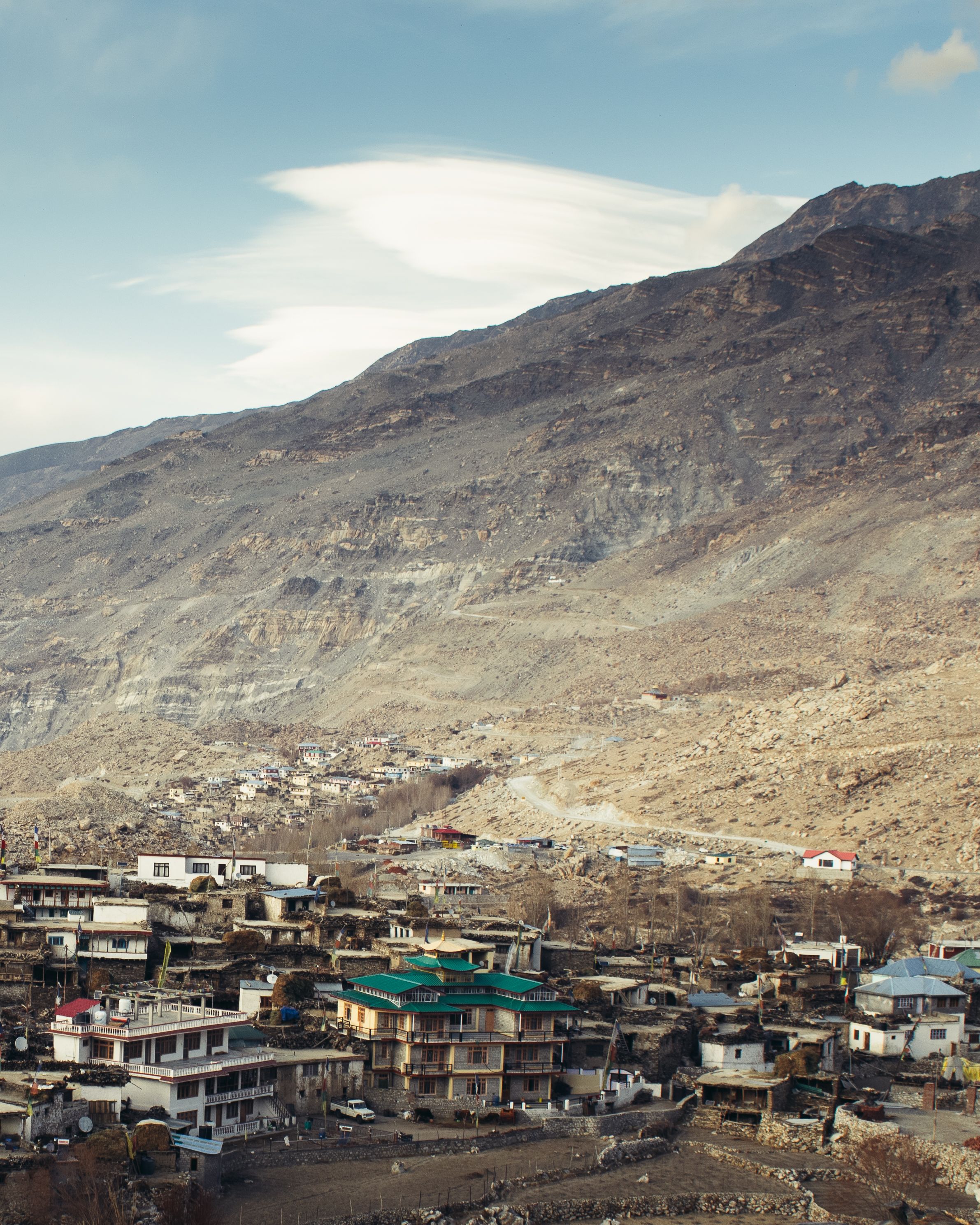 Aerial View of Buildings Near Mountain · Free Stock Photo
