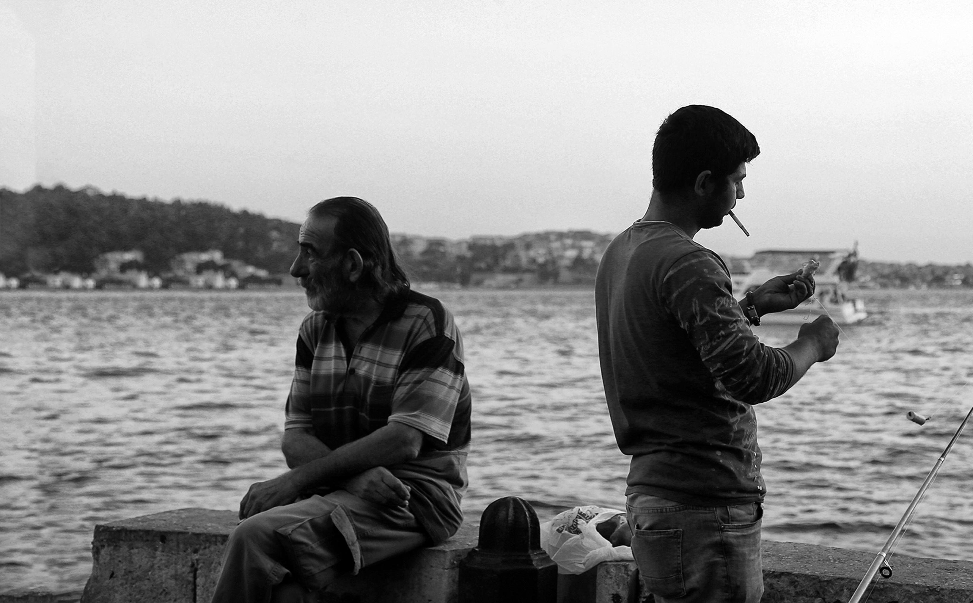 Men Beside the Sea · Free Stock Photo