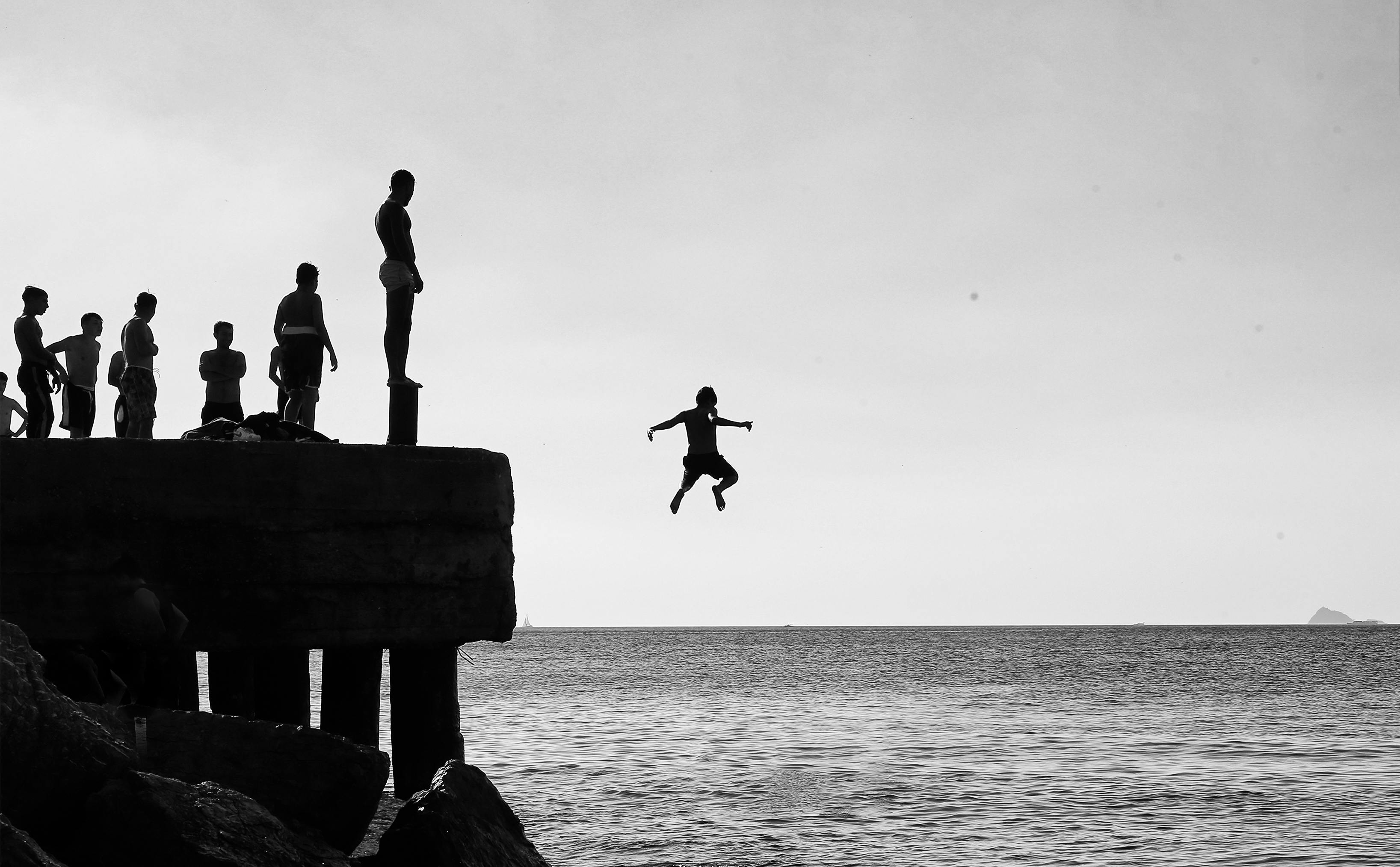 Man Jumping from a Ship to Water · Free Stock Photo