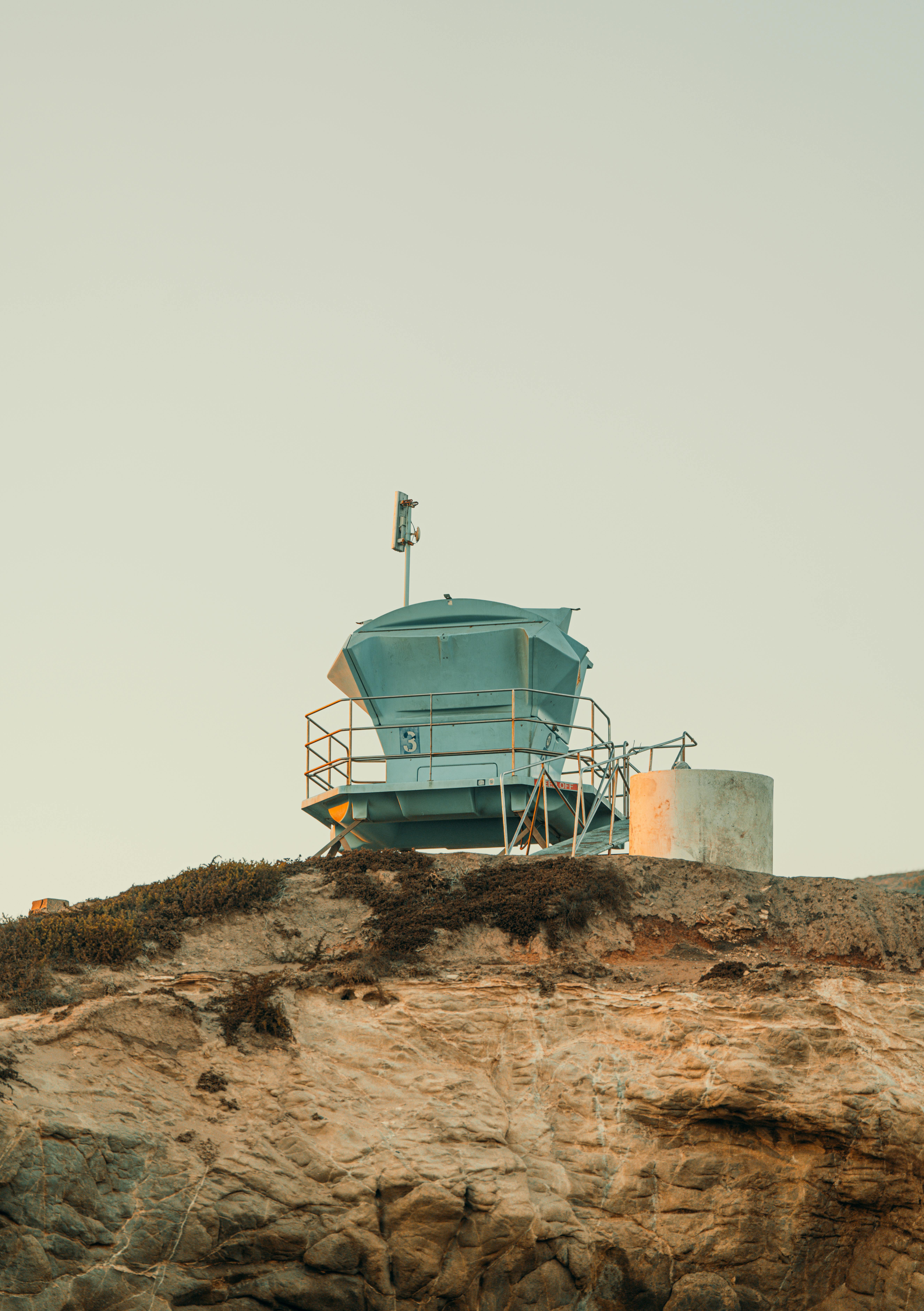 White Wooden Lifeguard House Near Shoreline · Free Stock Photo