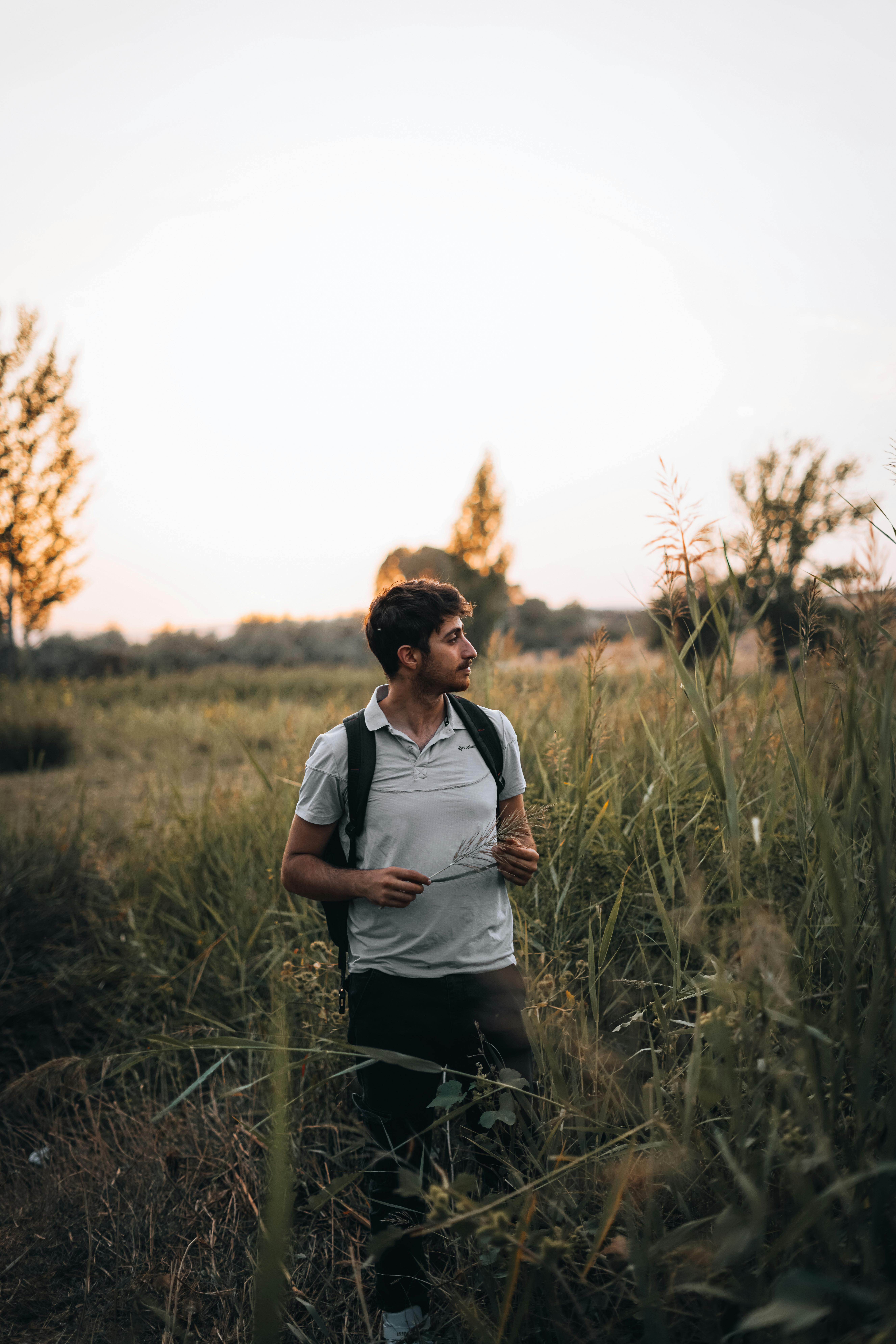 A Man Standing on the Grass · Free Stock Photo