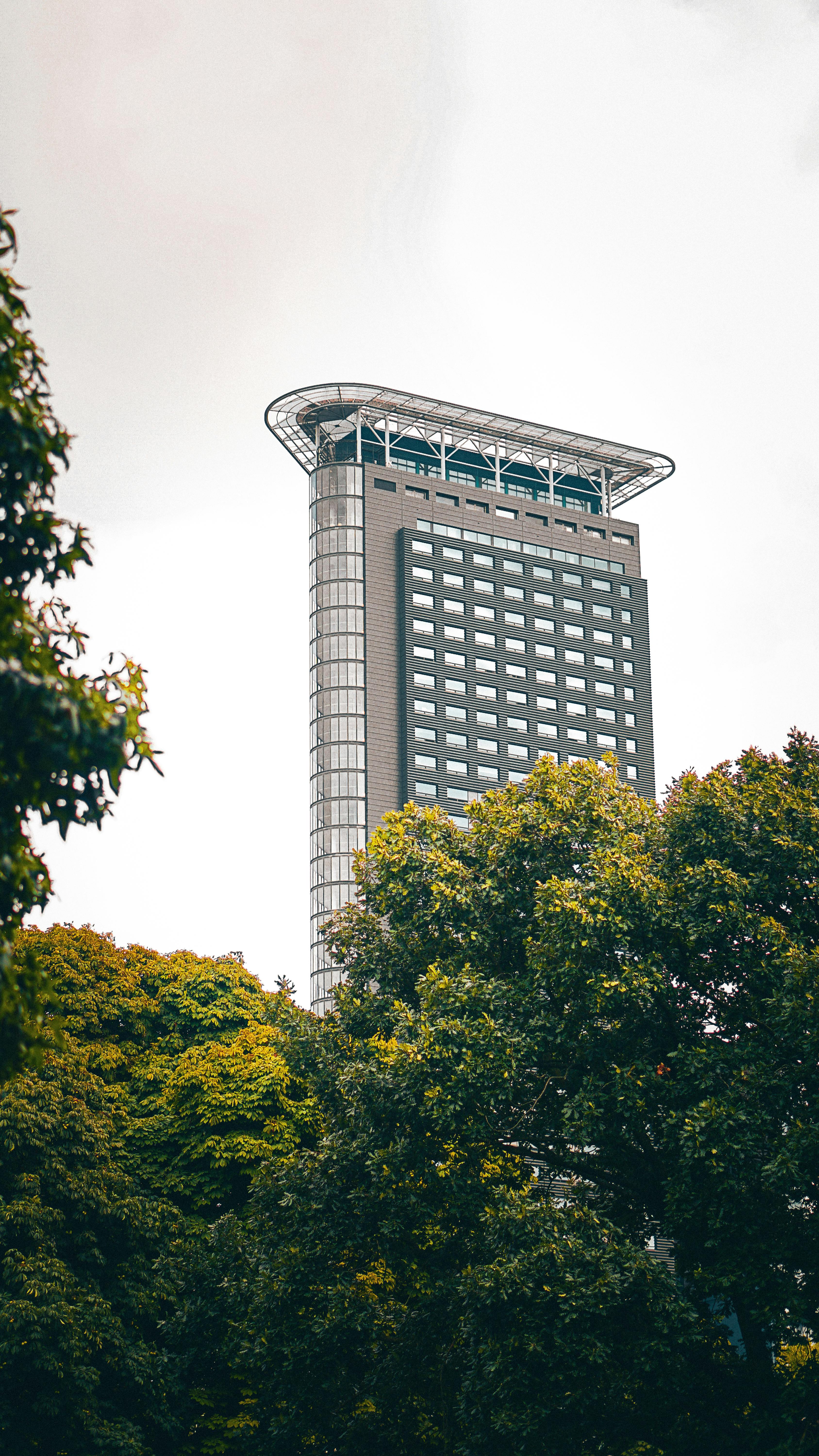 White High-rise Building Near Water · Free Stock Photo