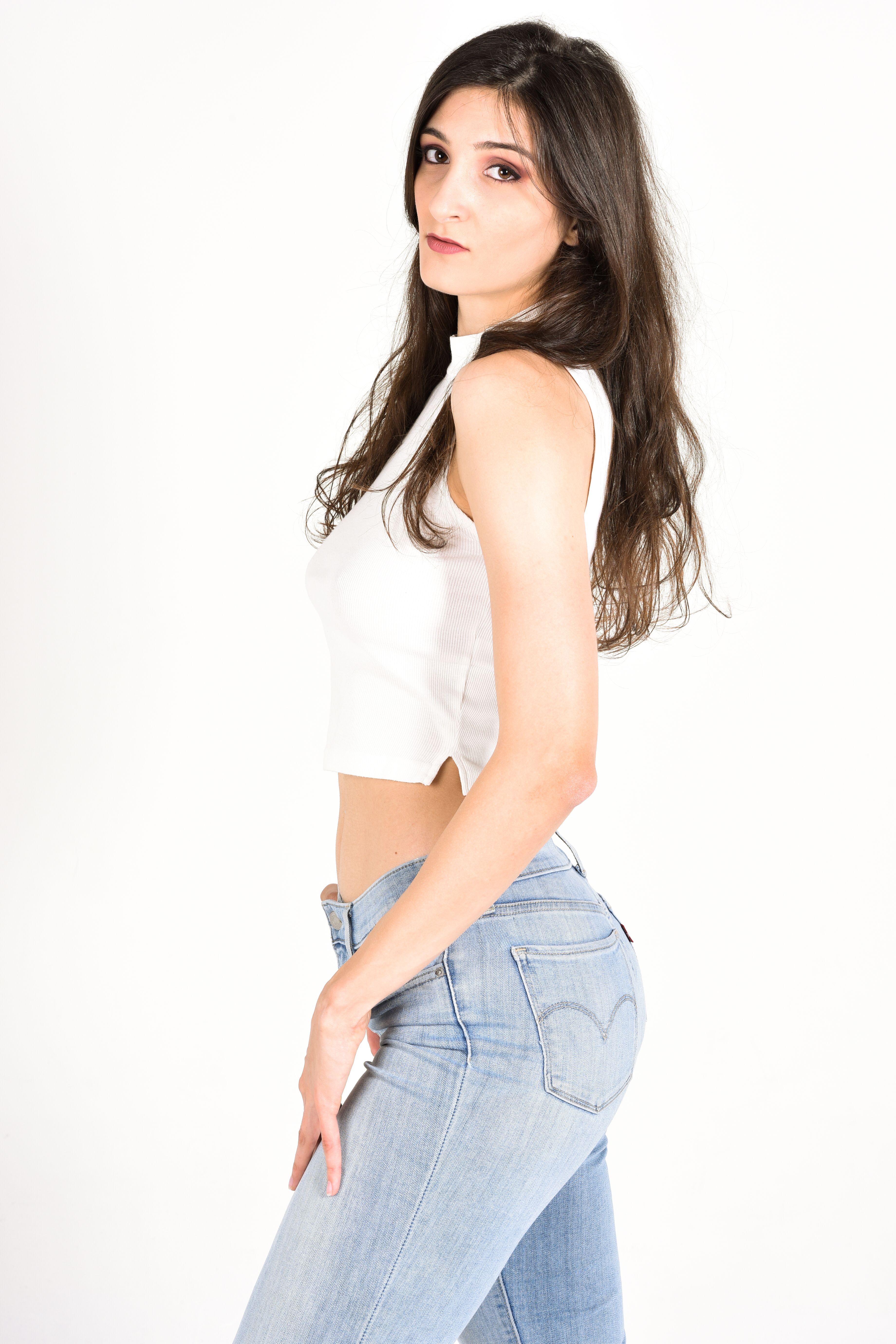 Woman in White Tank Top and Blue Denim Pants · Free Stock Photo