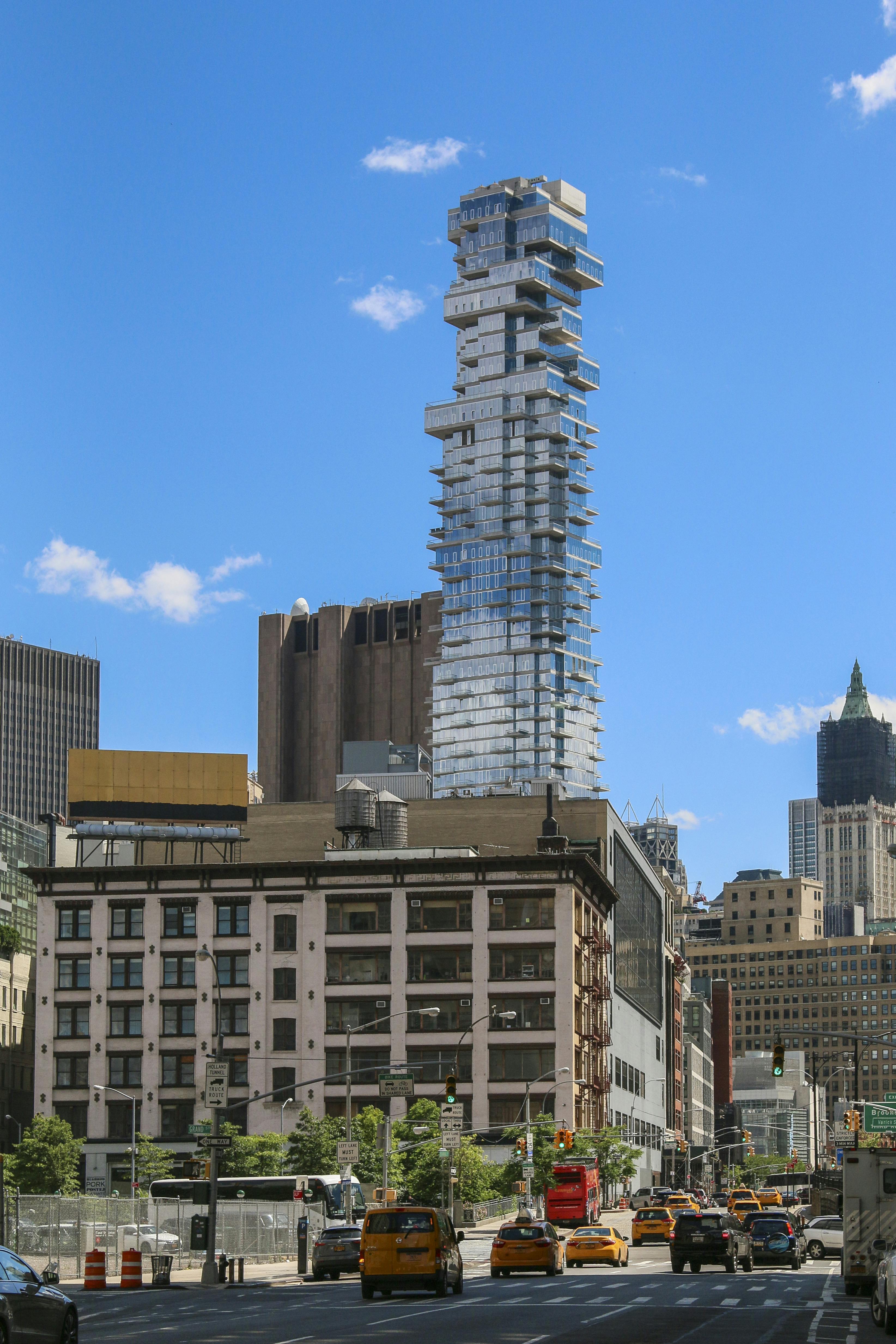 High Rise Building with Glass Panels Near the Concrete Building · Free ...