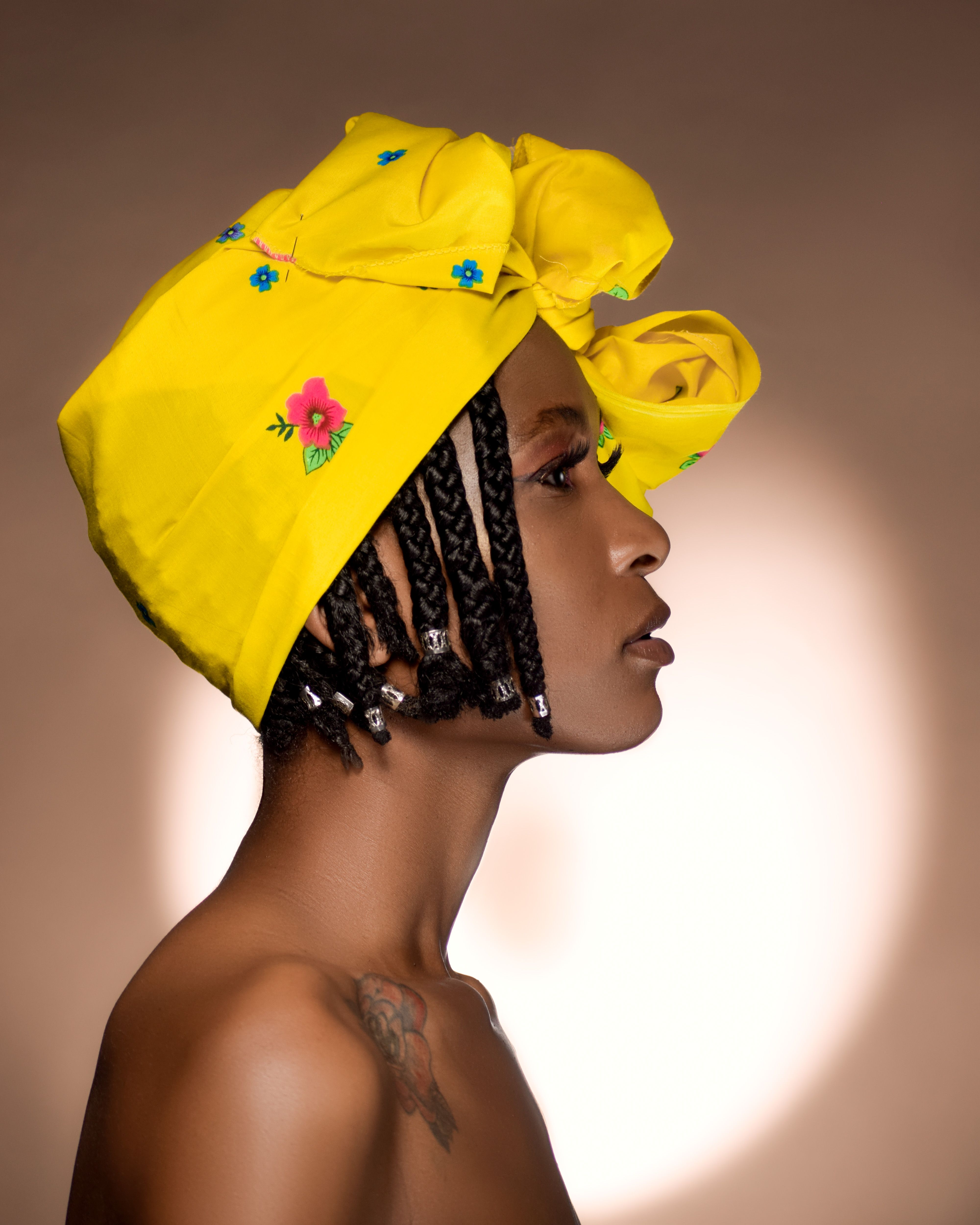 A Woman Wearing a Bandana with Braided Hair · Free Stock Photo