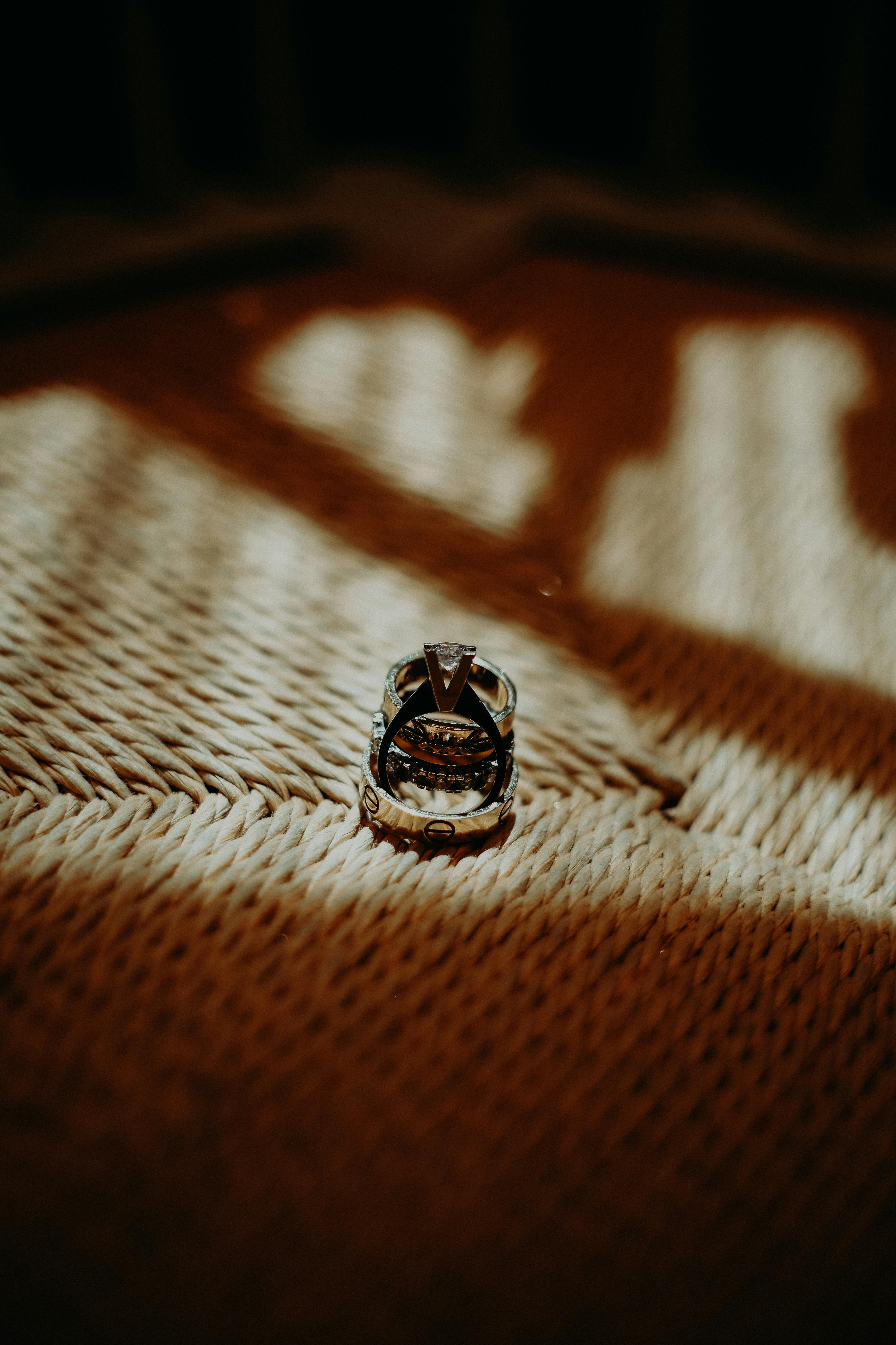 Close-Up Photo of Diamond Ring on Brown Textile · Free Stock Photo