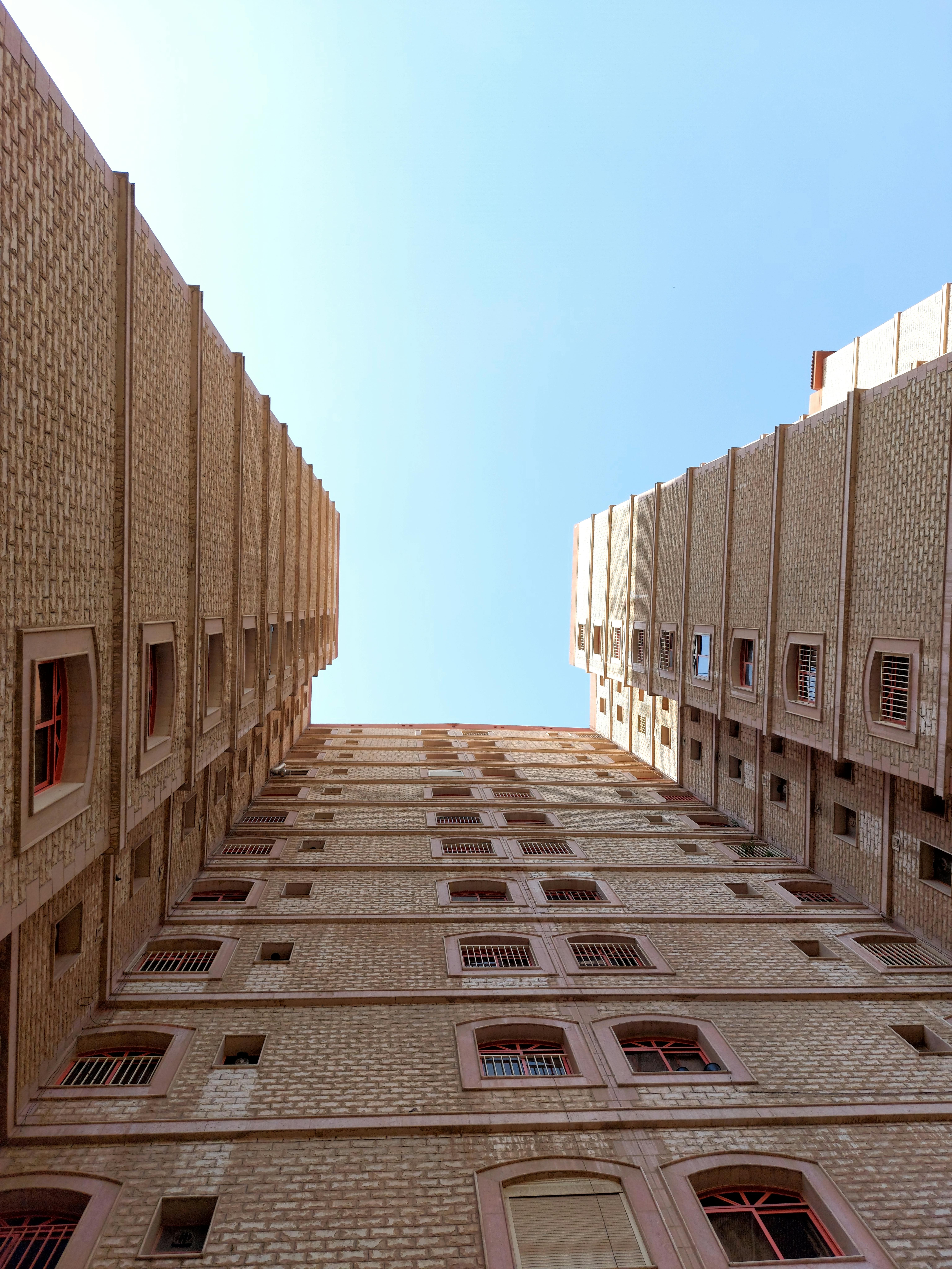 High Rise Brick Building with Arched Windows · Free Stock Photo