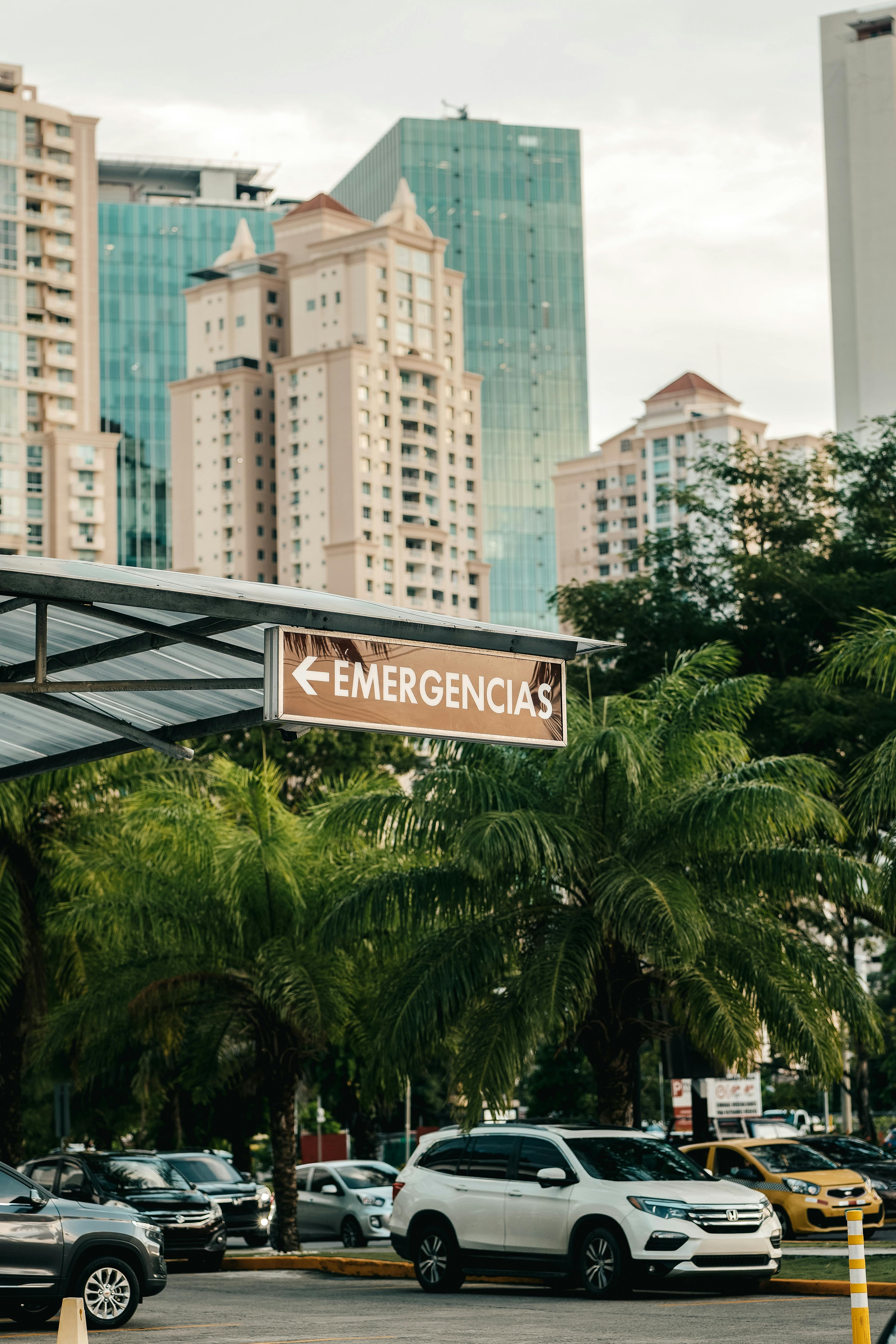 Cars on the Parking Lot near High Rise Buildings · Free Stock Photo