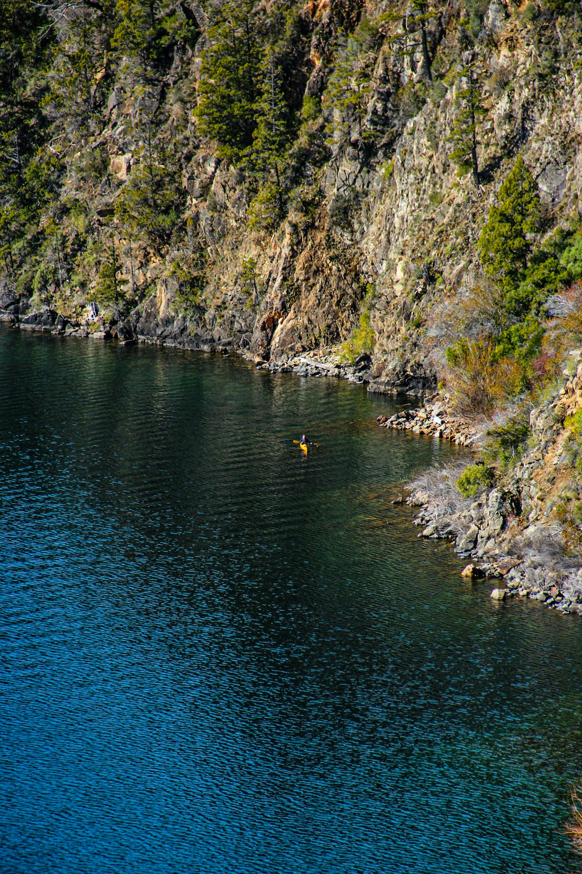 Aerial View of Kayak on Lake under Cliff · Free Stock Photo