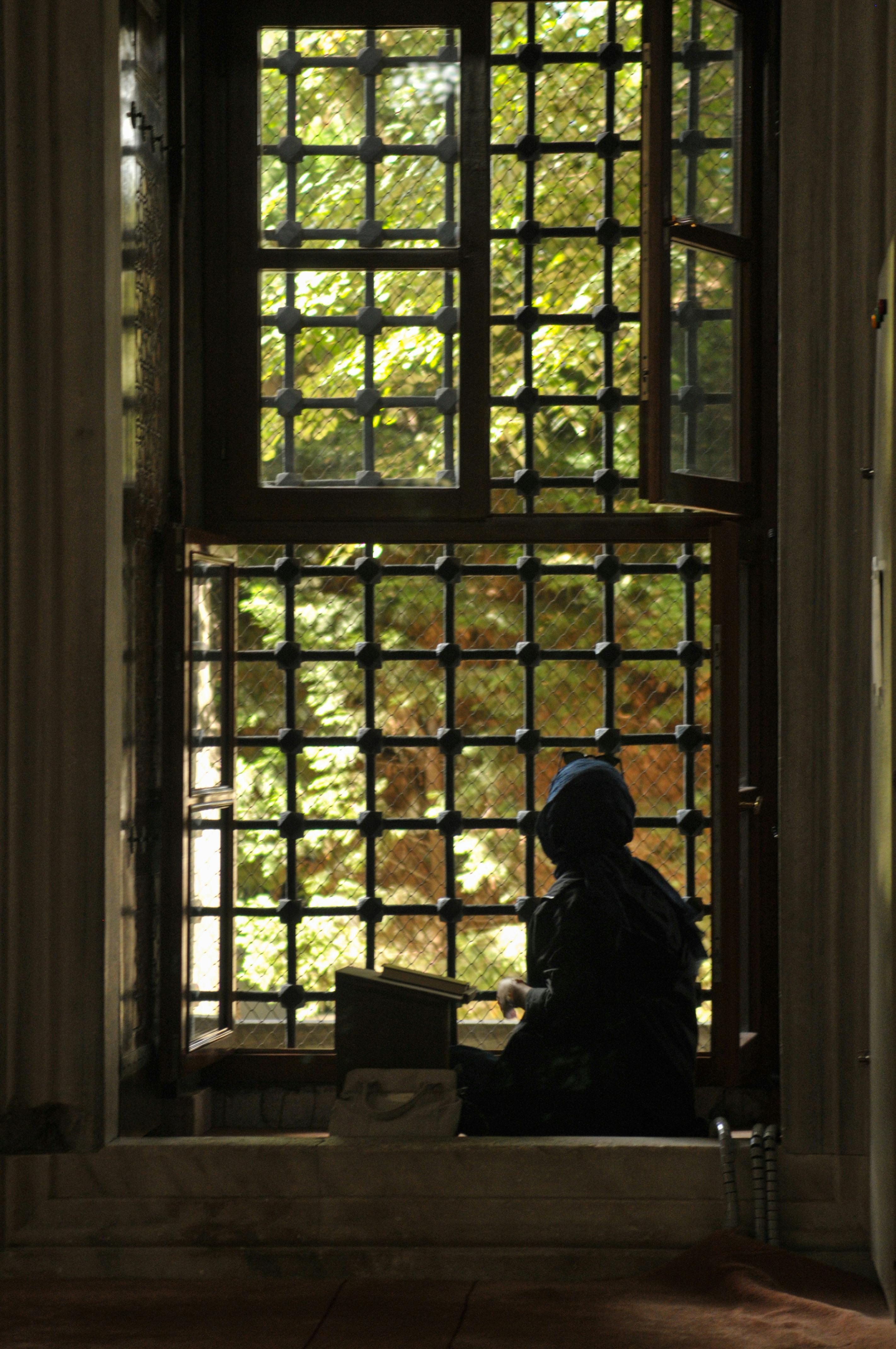 Person in Black Outfit Sitting Near the Window · Free Stock Photo