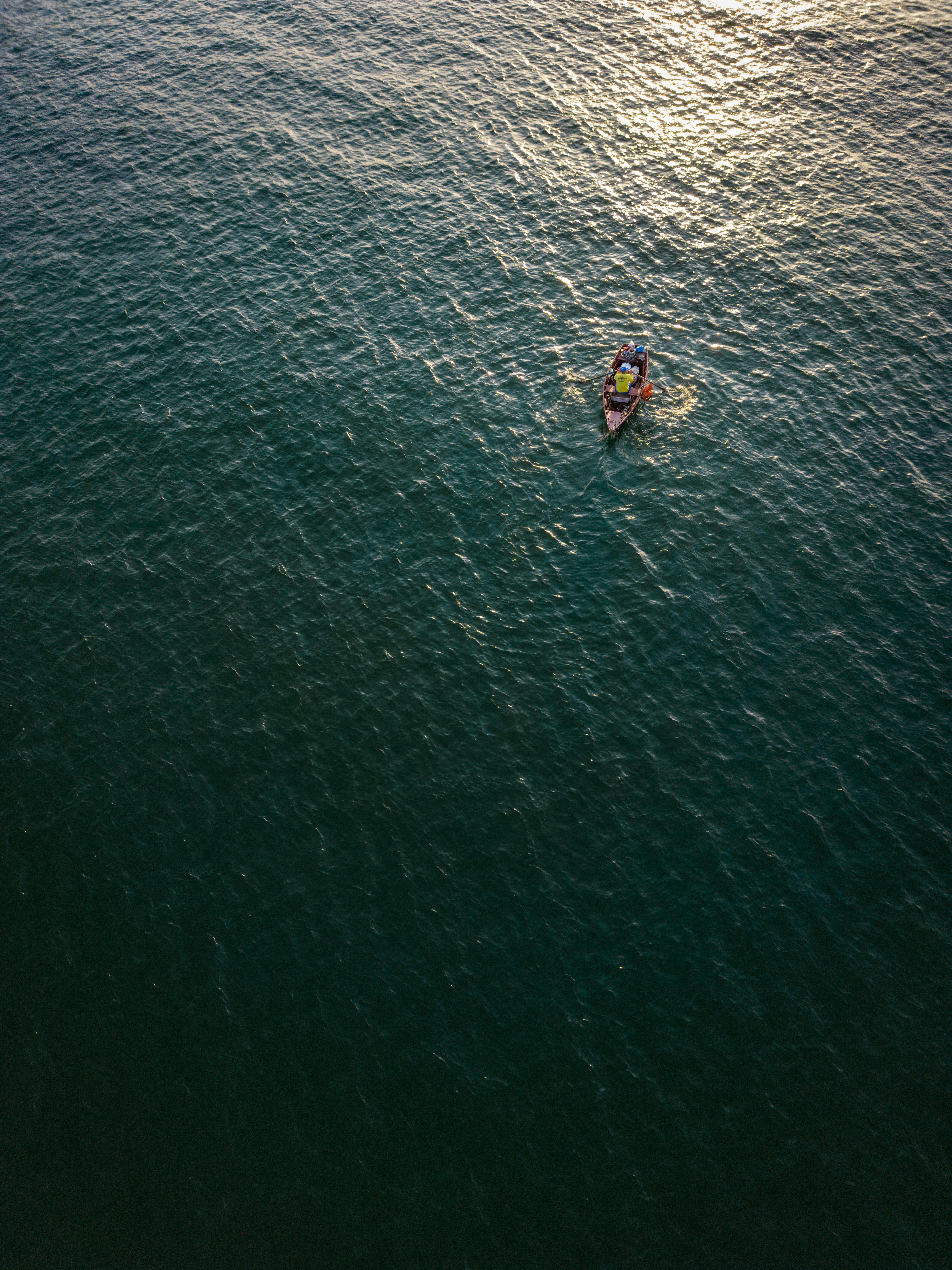 Aerial View of a Person Riding a Boat on the Sea · Free Stock Photo