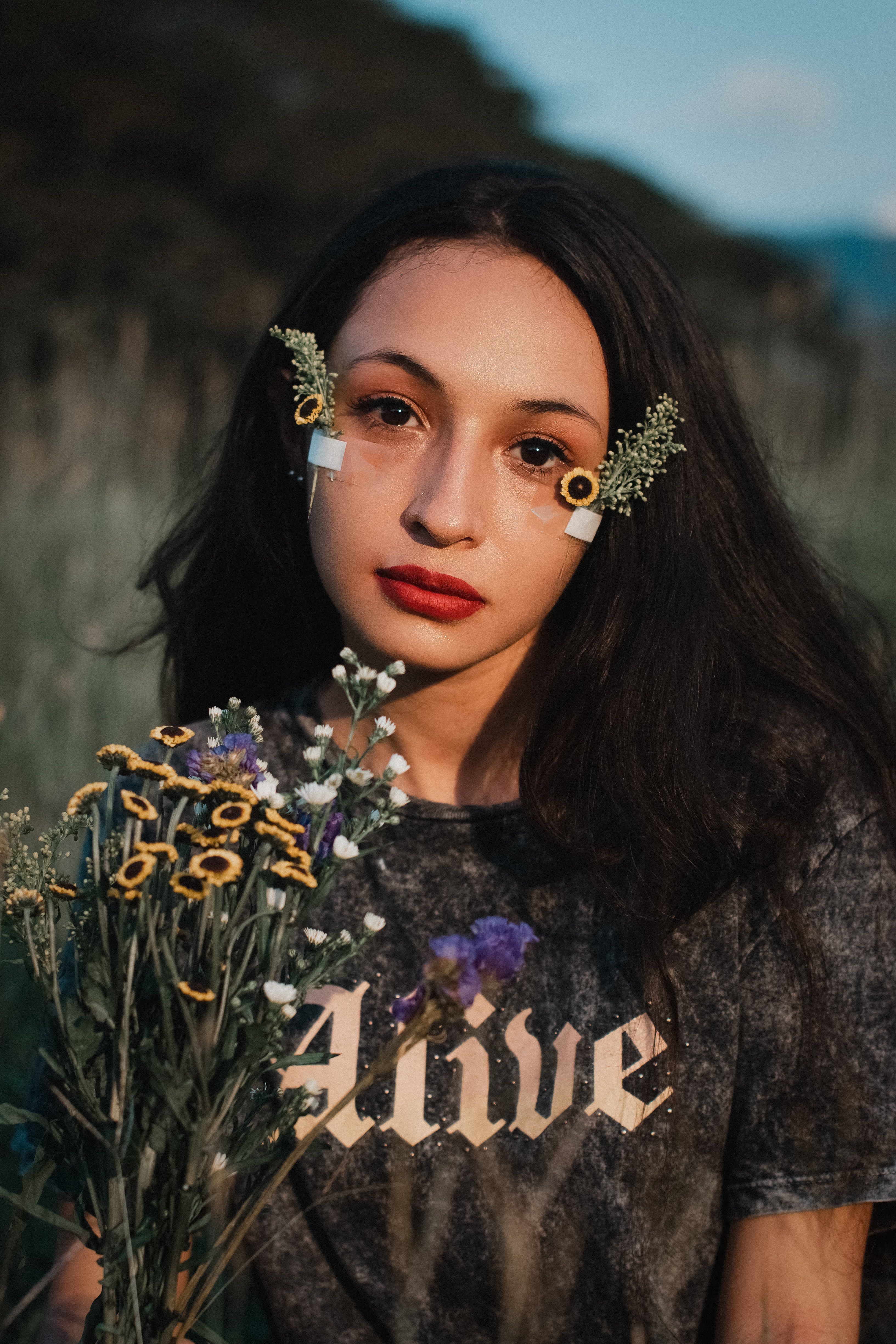 Woman Biting a Poppy Flower · Free Stock Photo