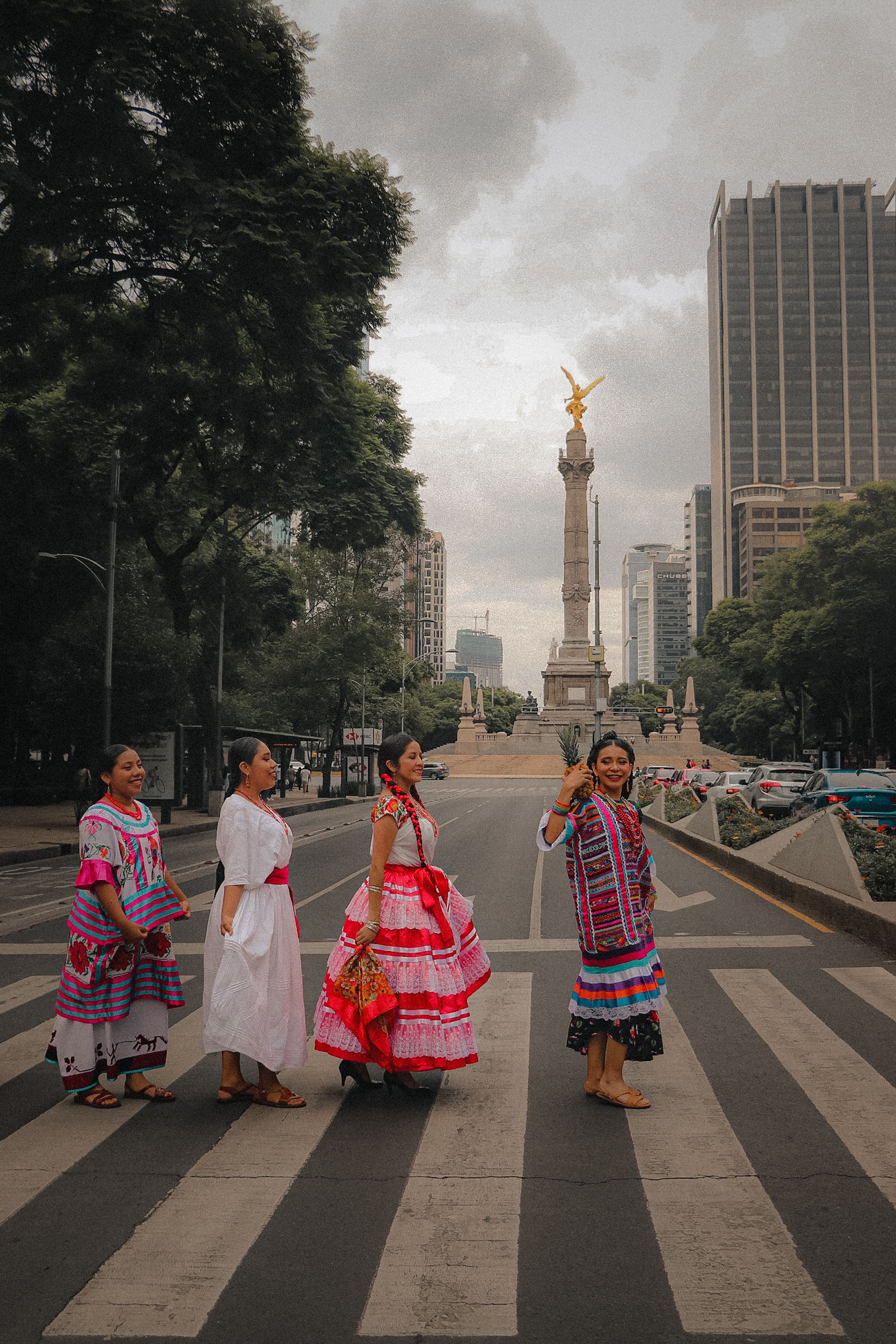 Woman in Traditional Clothes Walking on Pedestrian Lane · Free Stock Photo