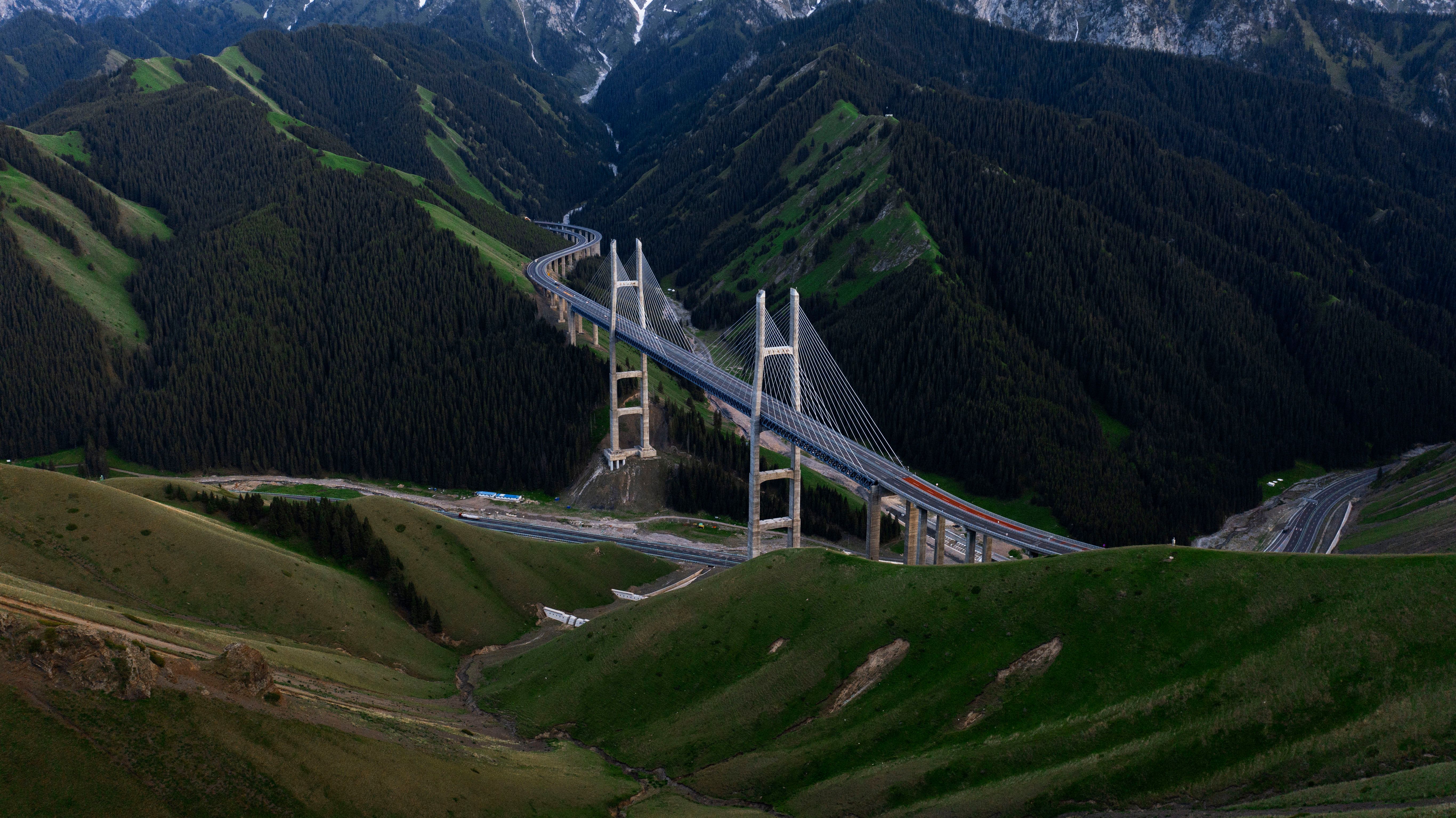 Suspension Bridge in Scenic Mountains Landscape · Free Stock Photo