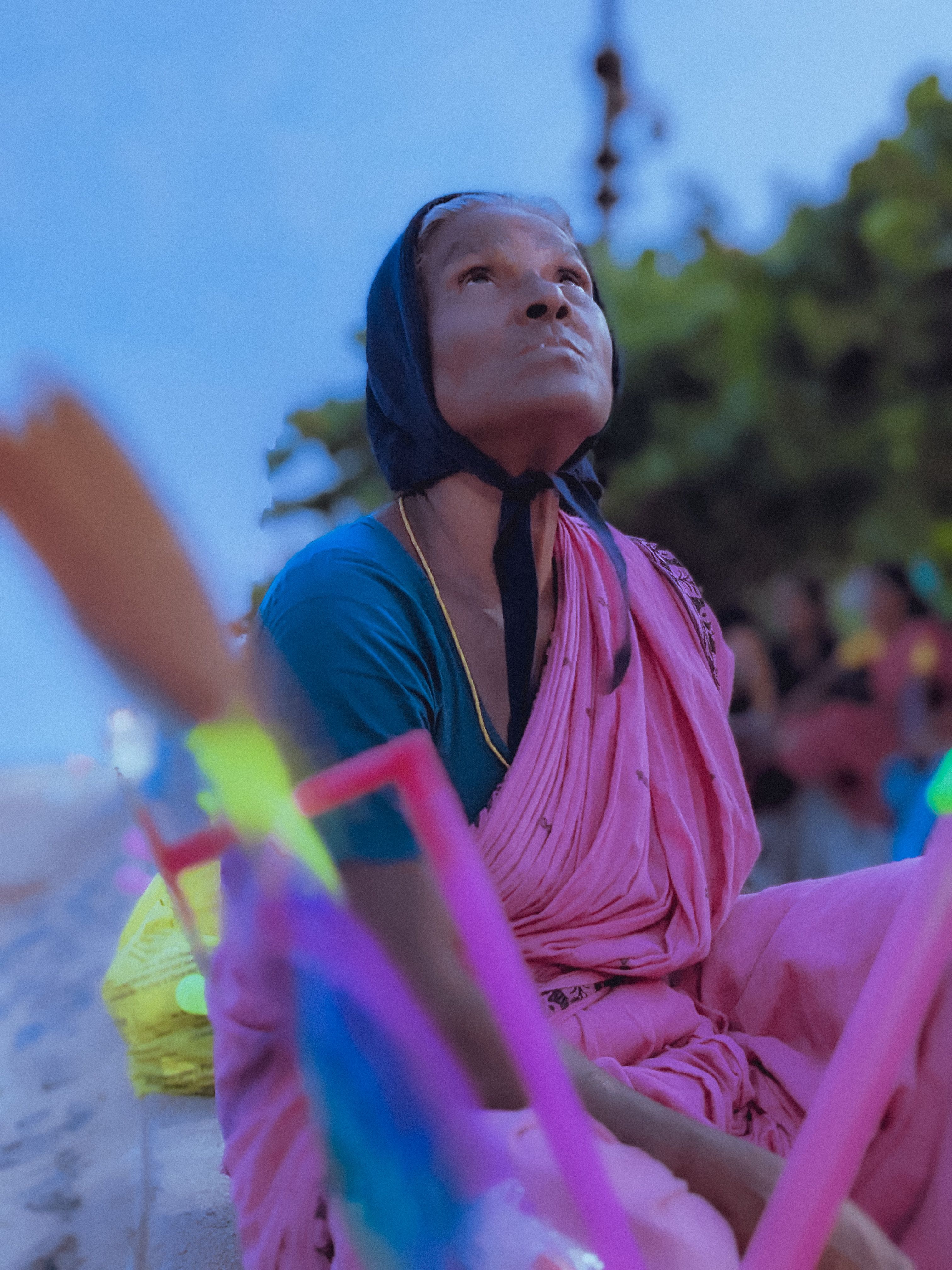 A Woman in Pink Robe Looking Up · Free Stock Photo