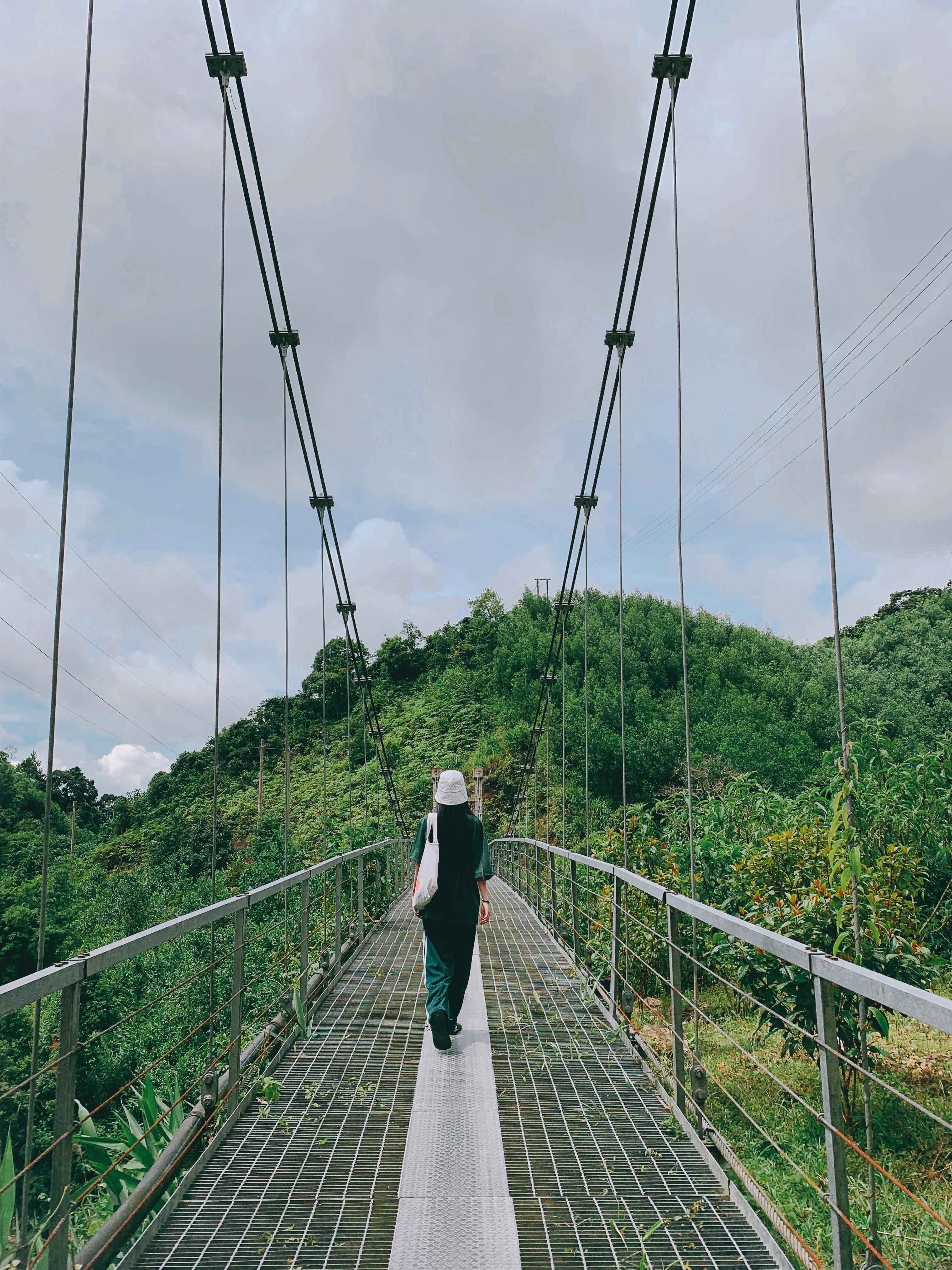A Woman Walking on the Bridge · Free Stock Photo