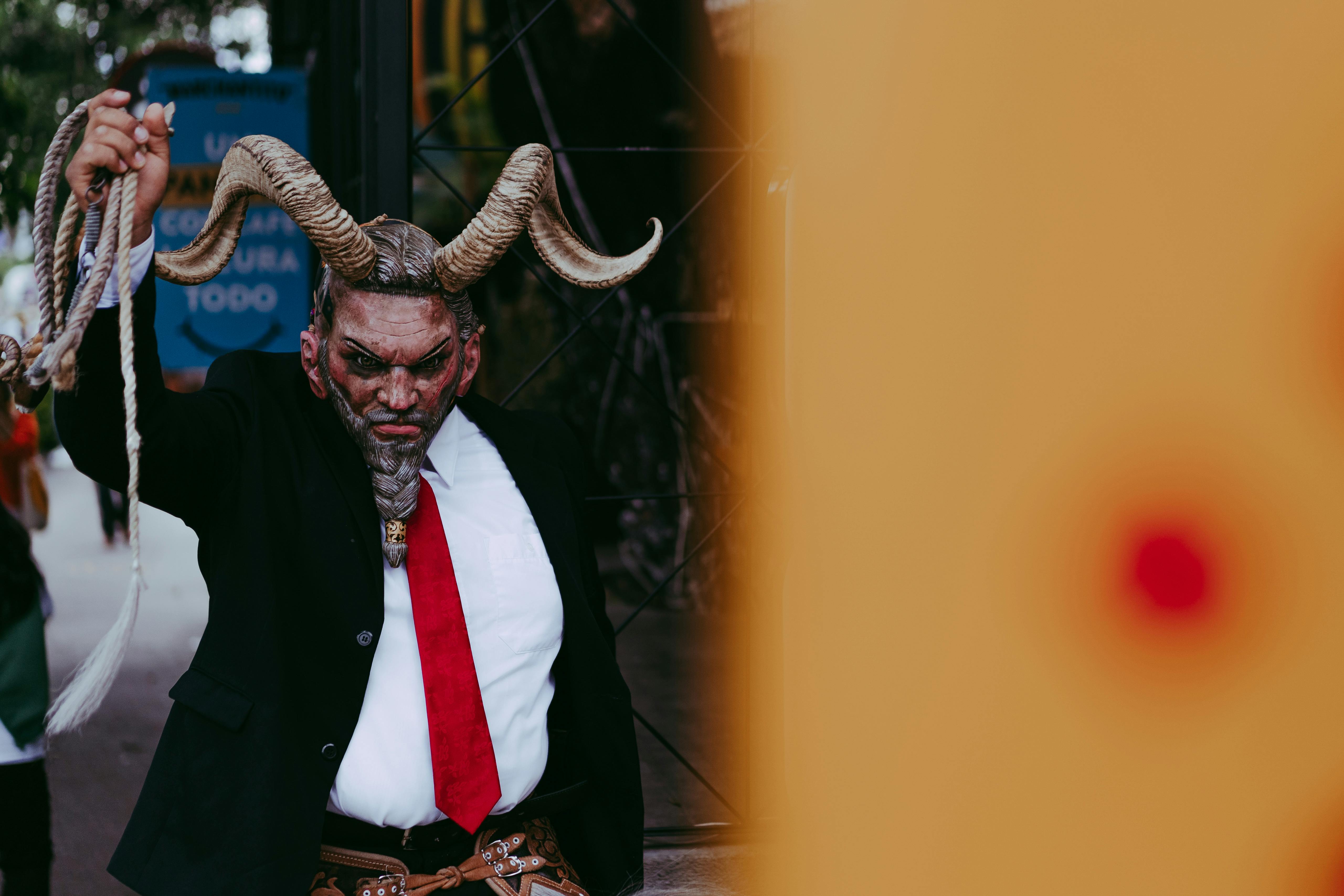 A Man in Black Suit Wearing Mask · Free Stock Photo