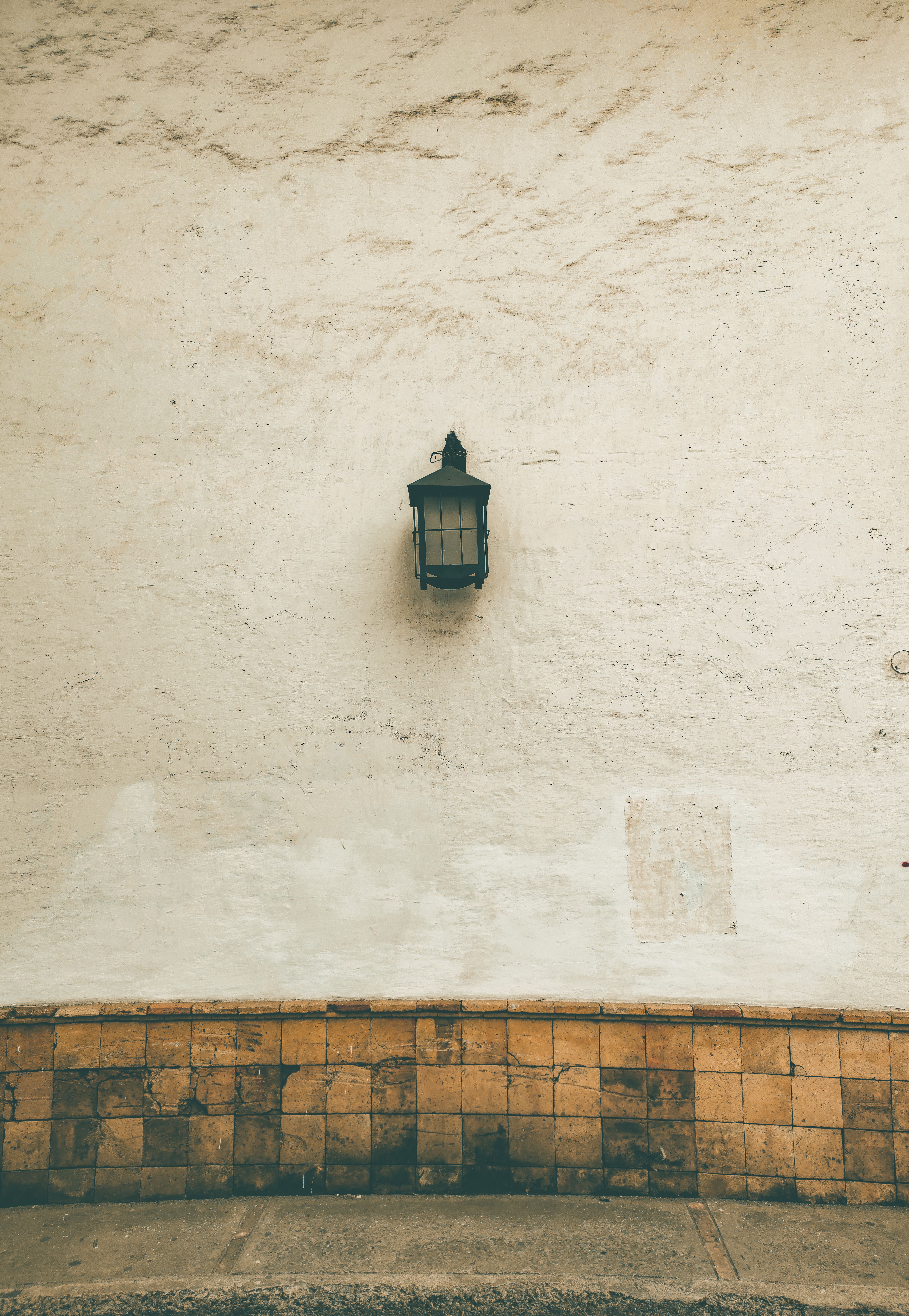 Lantern Hanging on Building Wall · Free Stock Photo