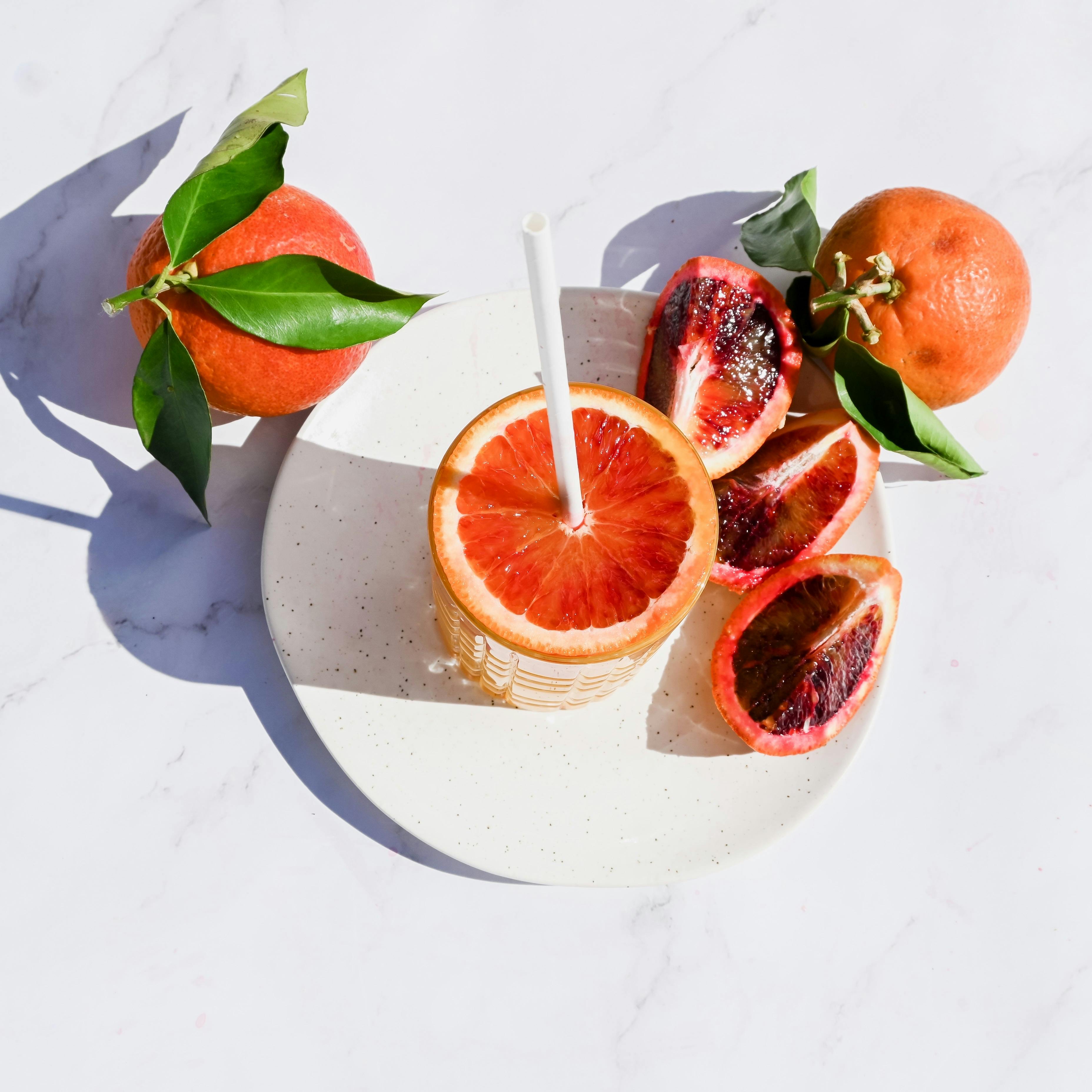 Fruit Juice on White Ceramic Plate · Free Stock Photo