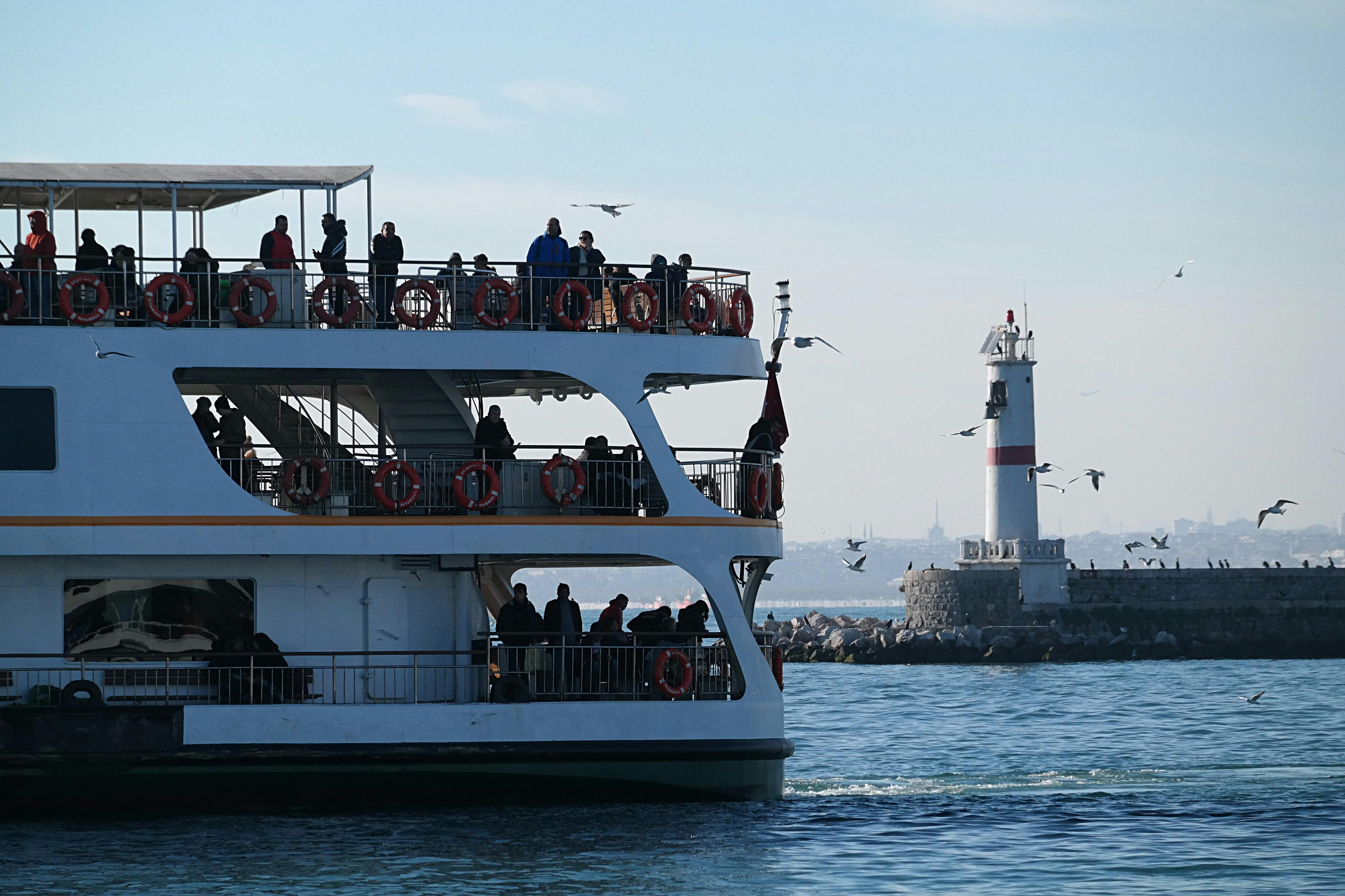 People Riding White Ferry Boat · Free Stock Photo