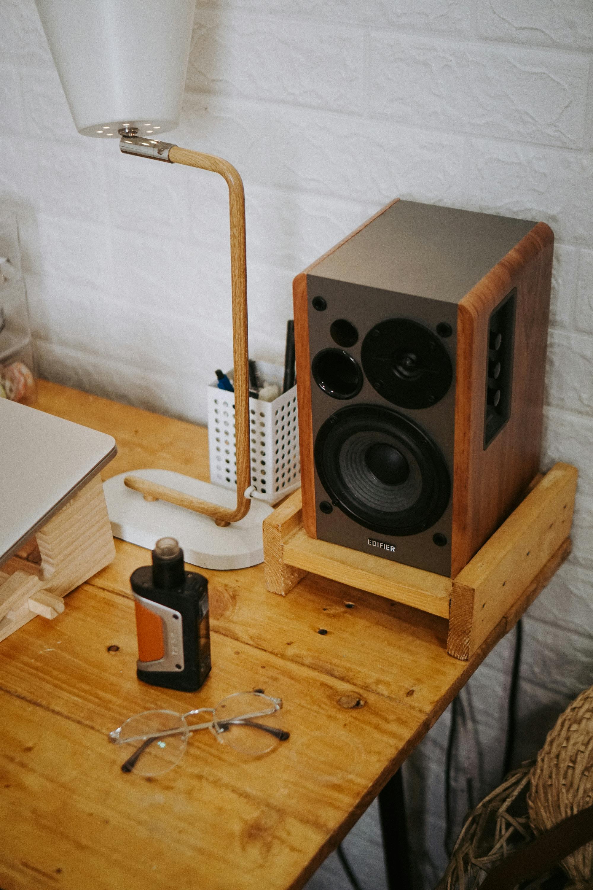 A Brown Wooden Side table with Speaker · Free Stock Photo