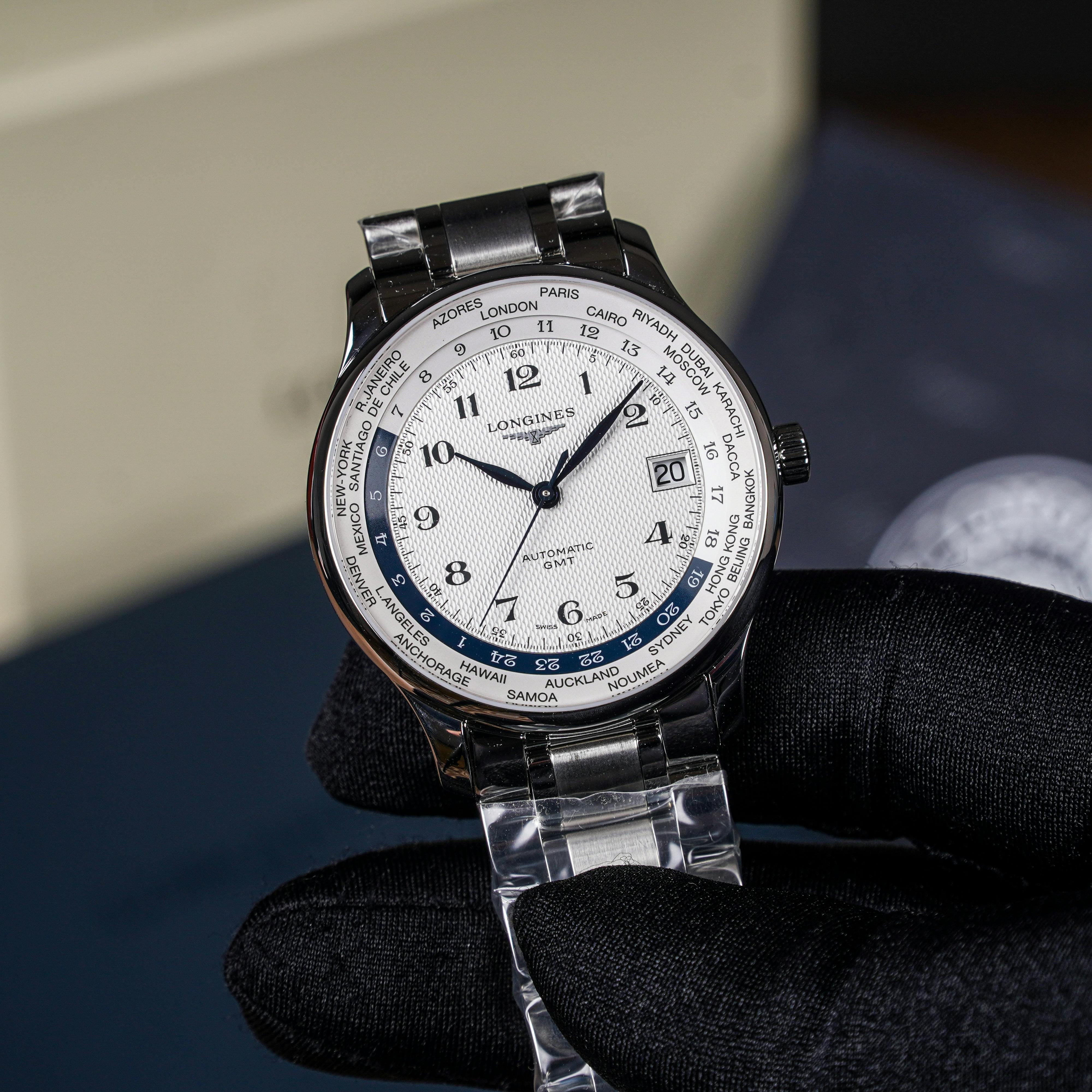 A Hand Wearing Black Gloves while Holding Silver Wristwatch · Free ...