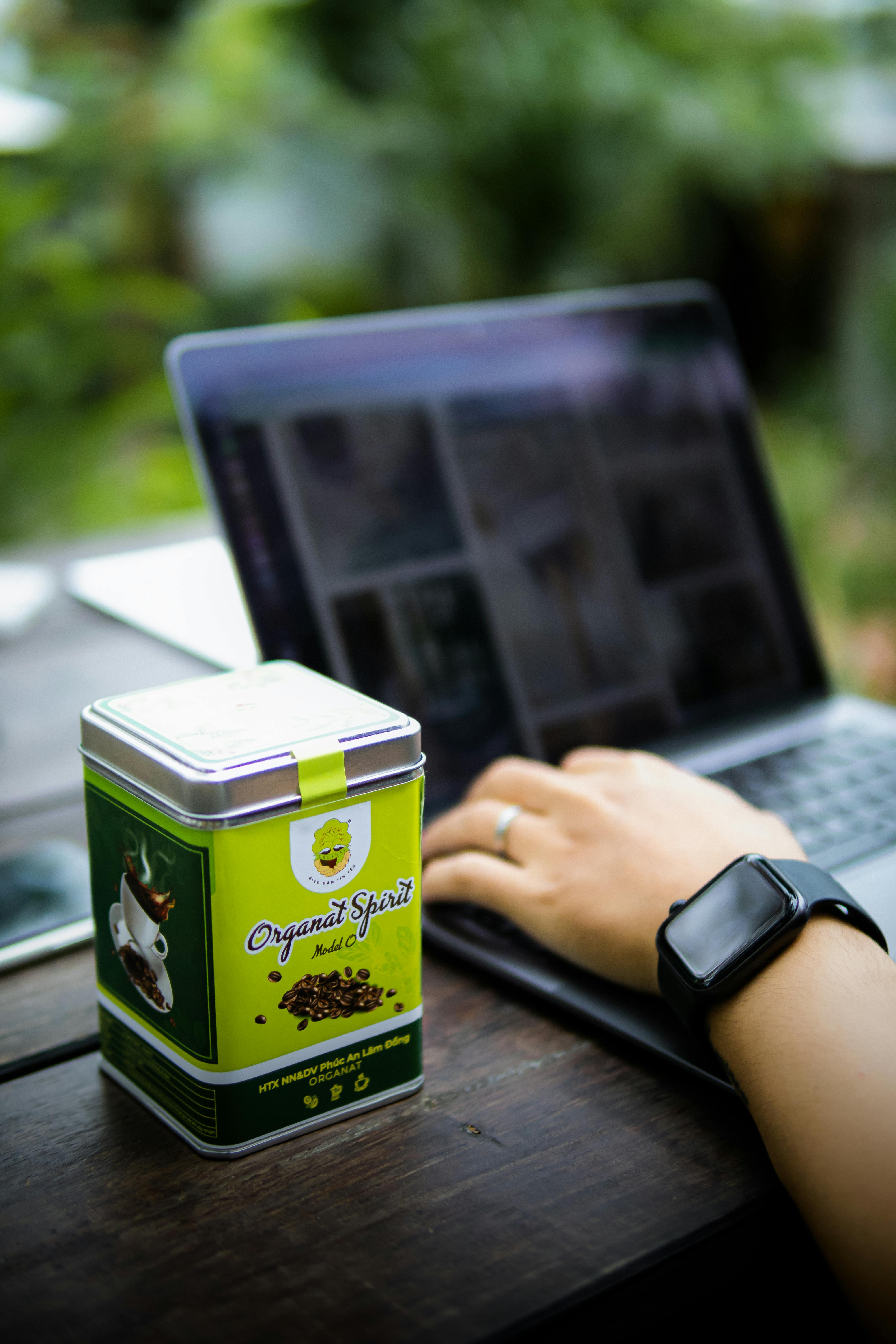 Green Labeled Container on the Table · Free Stock Photo