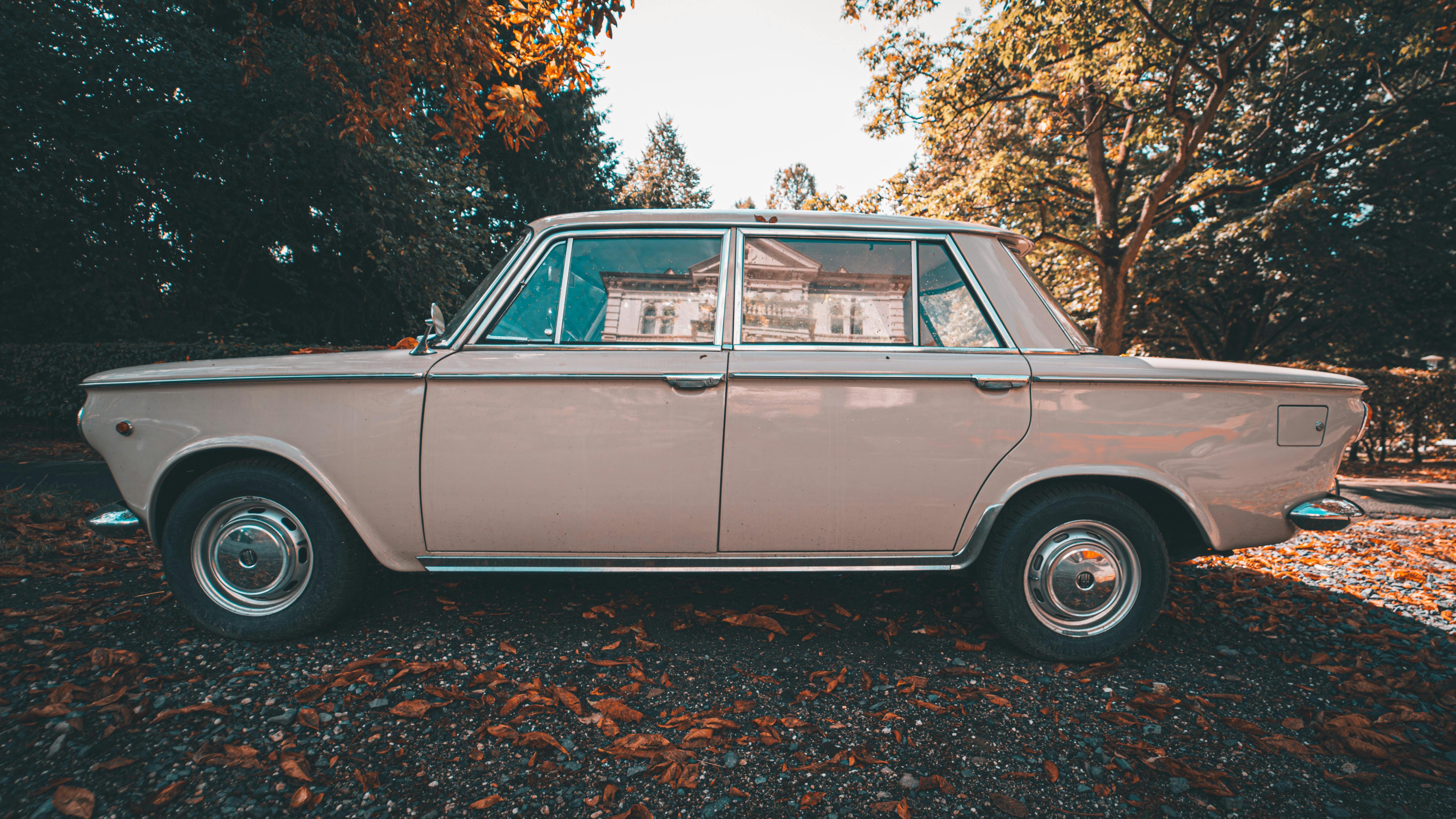 A Gray Vintage Car Parked on the Street · Free Stock Photo