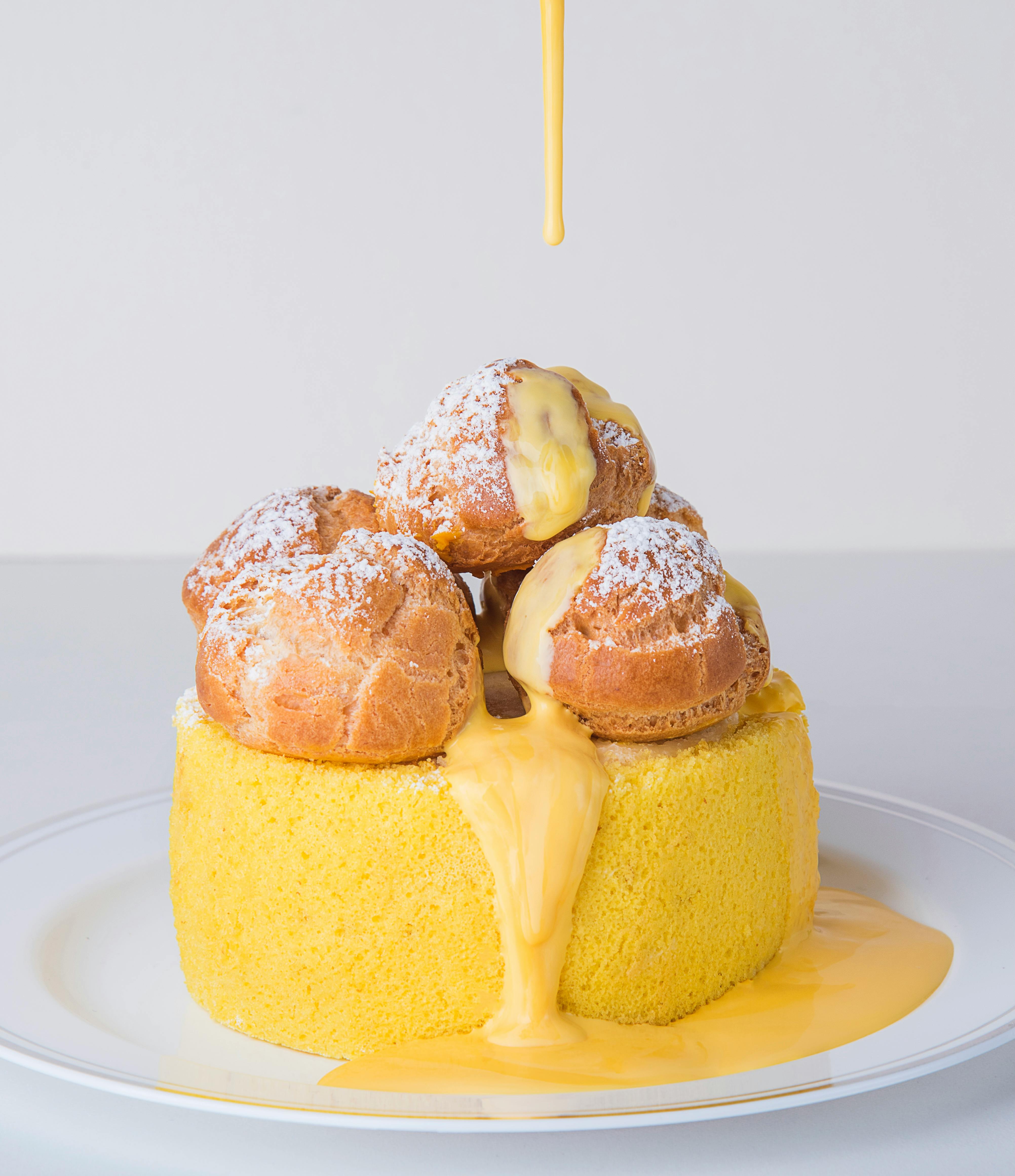 A Person Holding a Layer Cake · Free Stock Photo