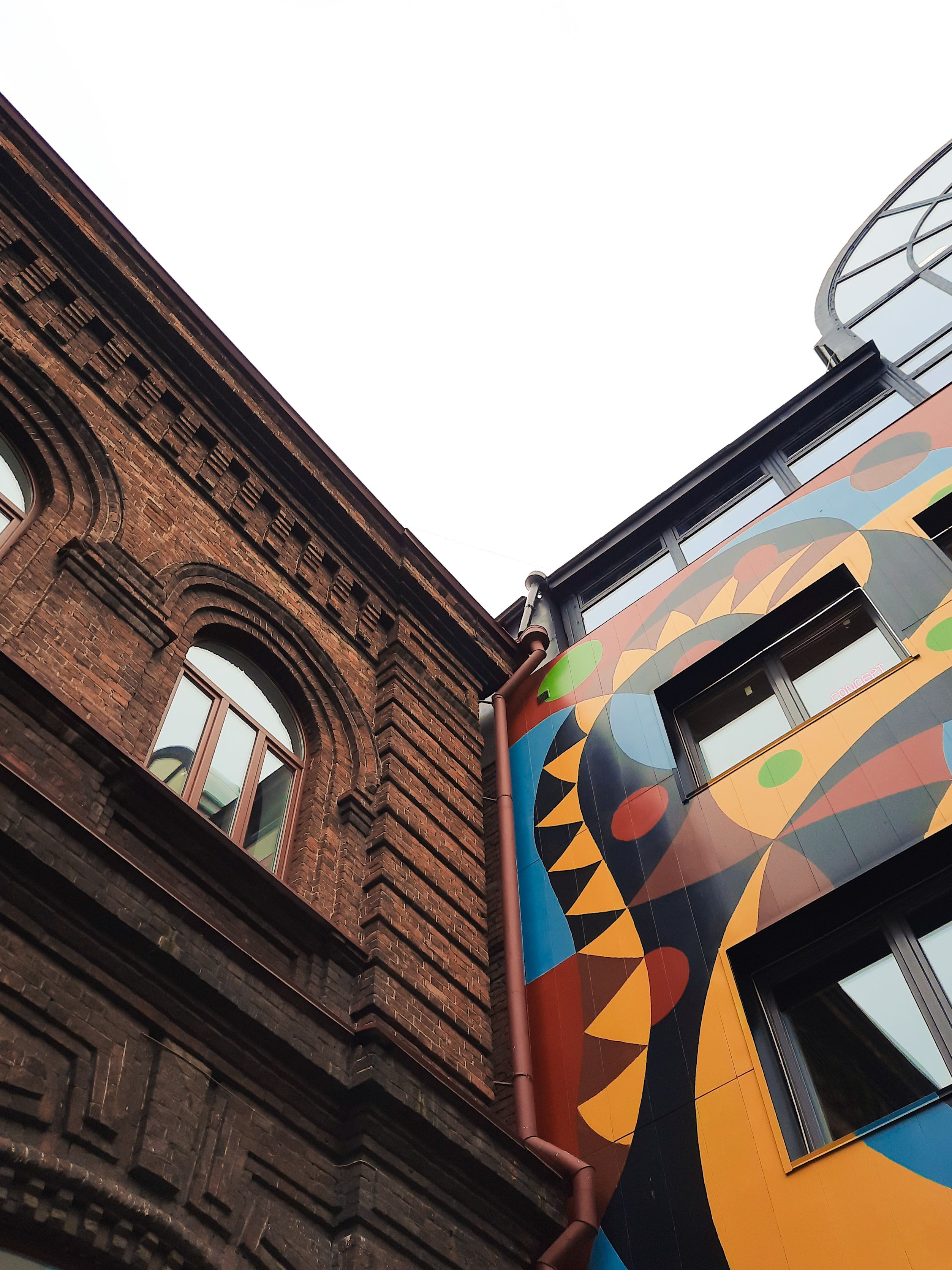 Low-Angle Shot of Building with Graffiti on the Wall · Free Stock Photo