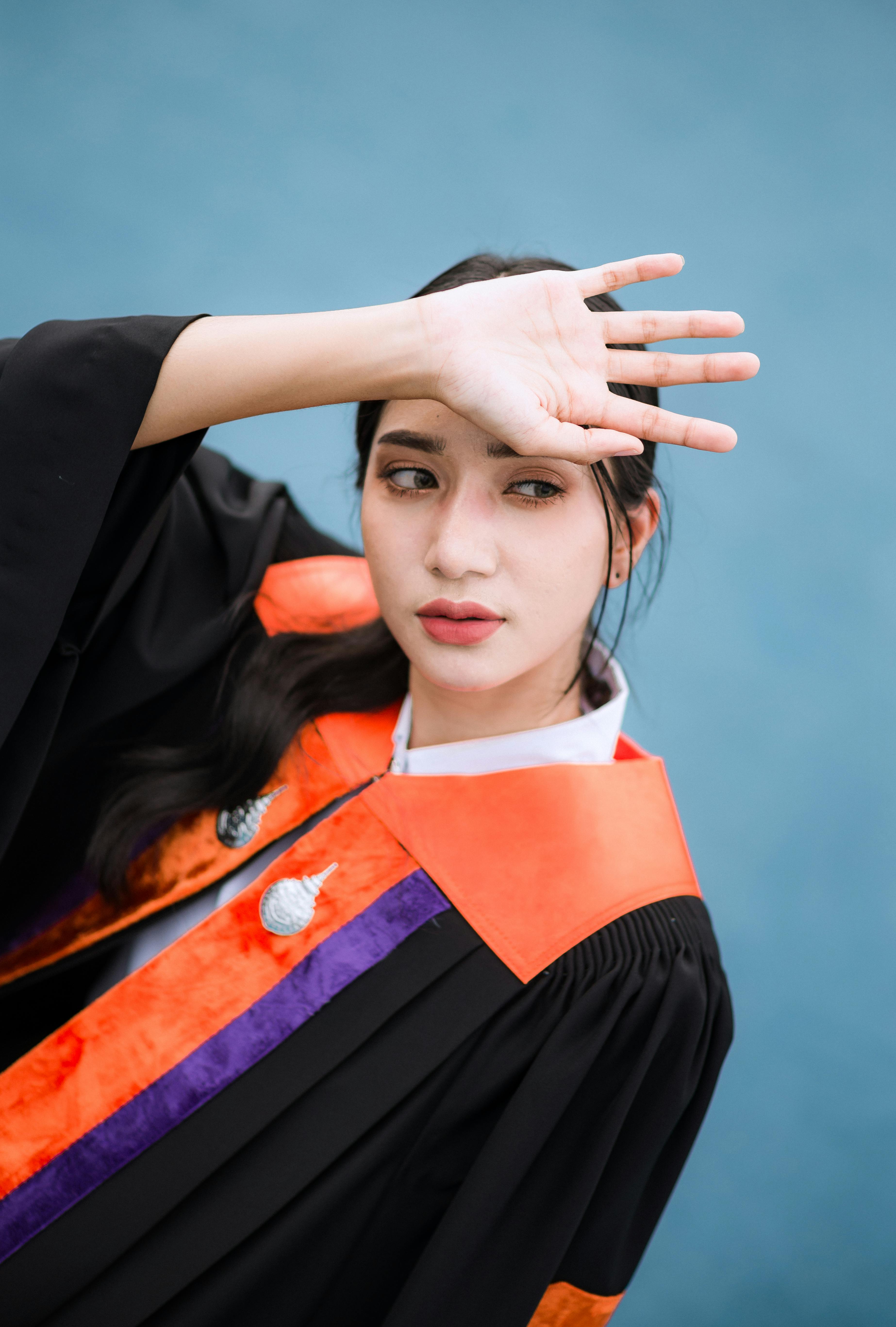Woman Wearing Black Graduation Gown and Hat · Free Stock Photo