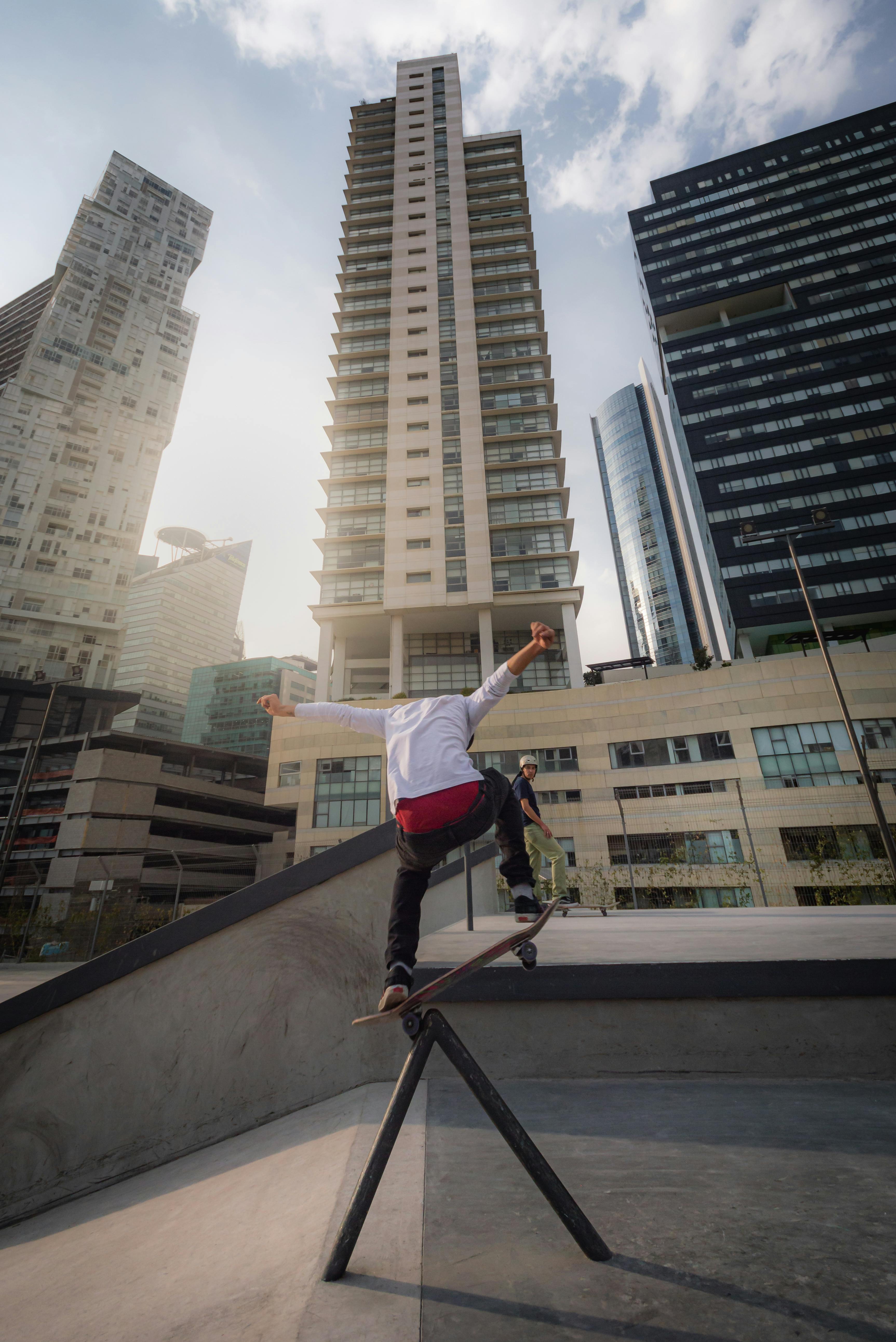 Person Skateboarding on Black Metal Railing · Free Stock Photo