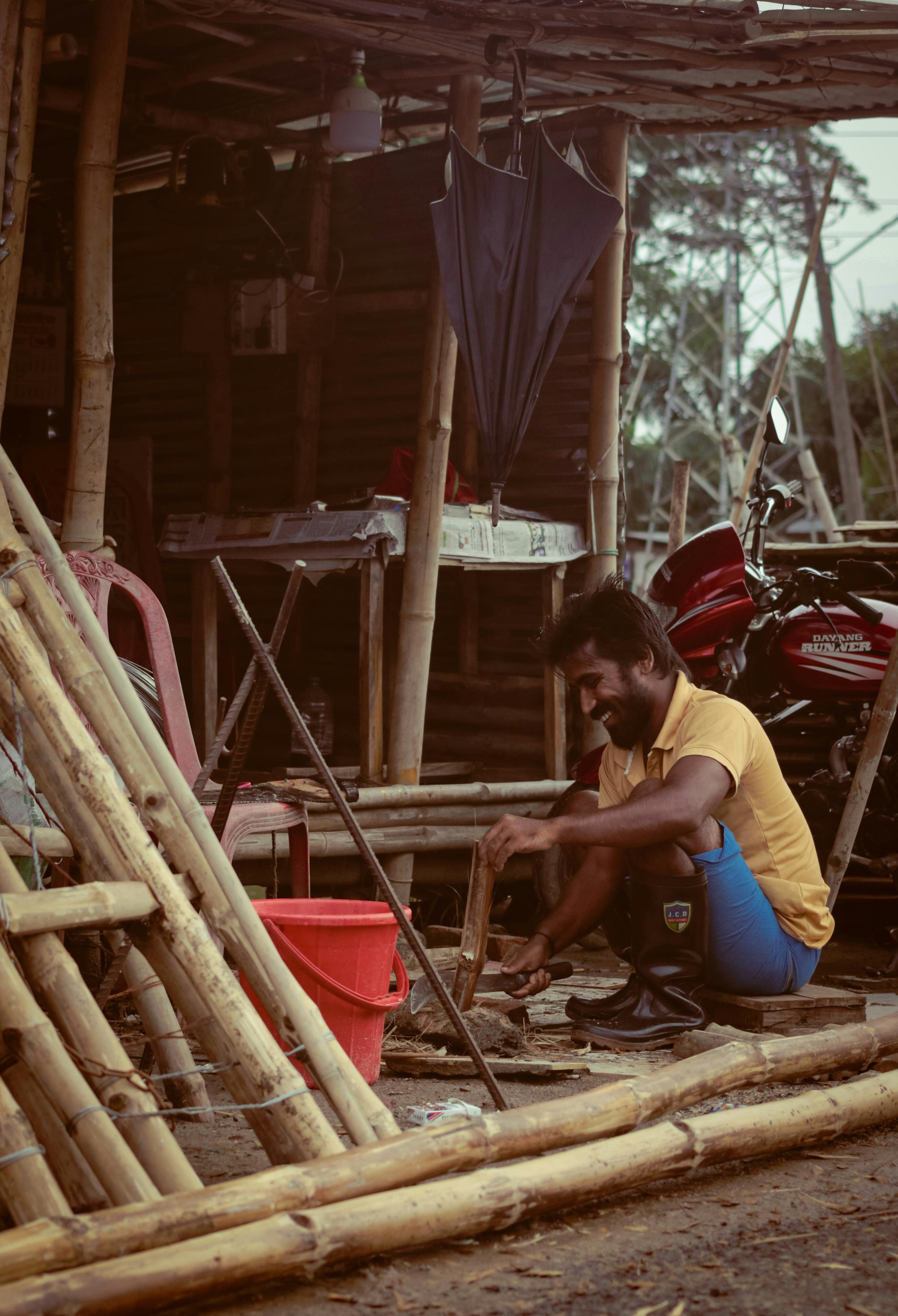 A Man Cutting Bamboo Woods · Free Stock Photo