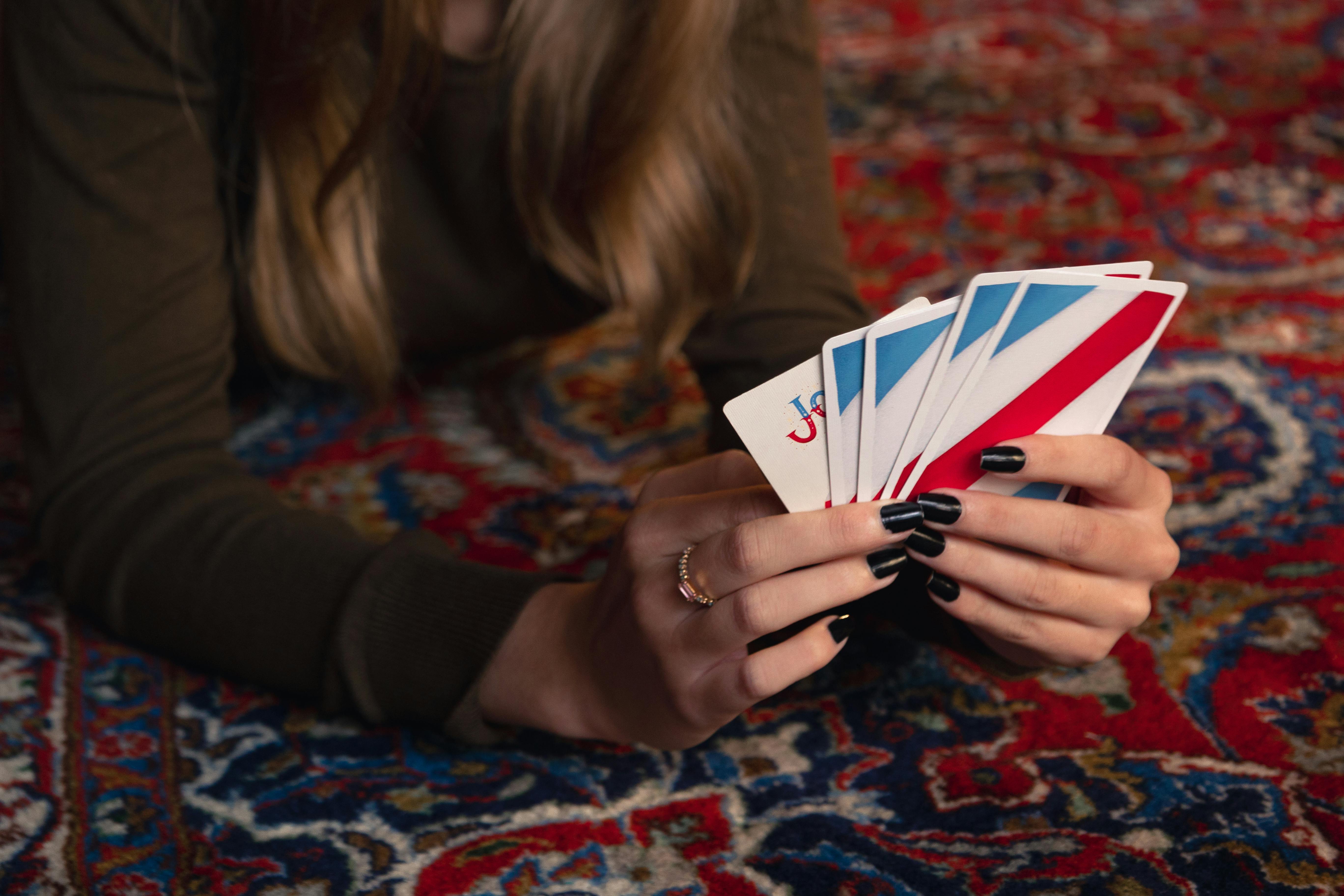 A Person Holding Cards · Free Stock Photo