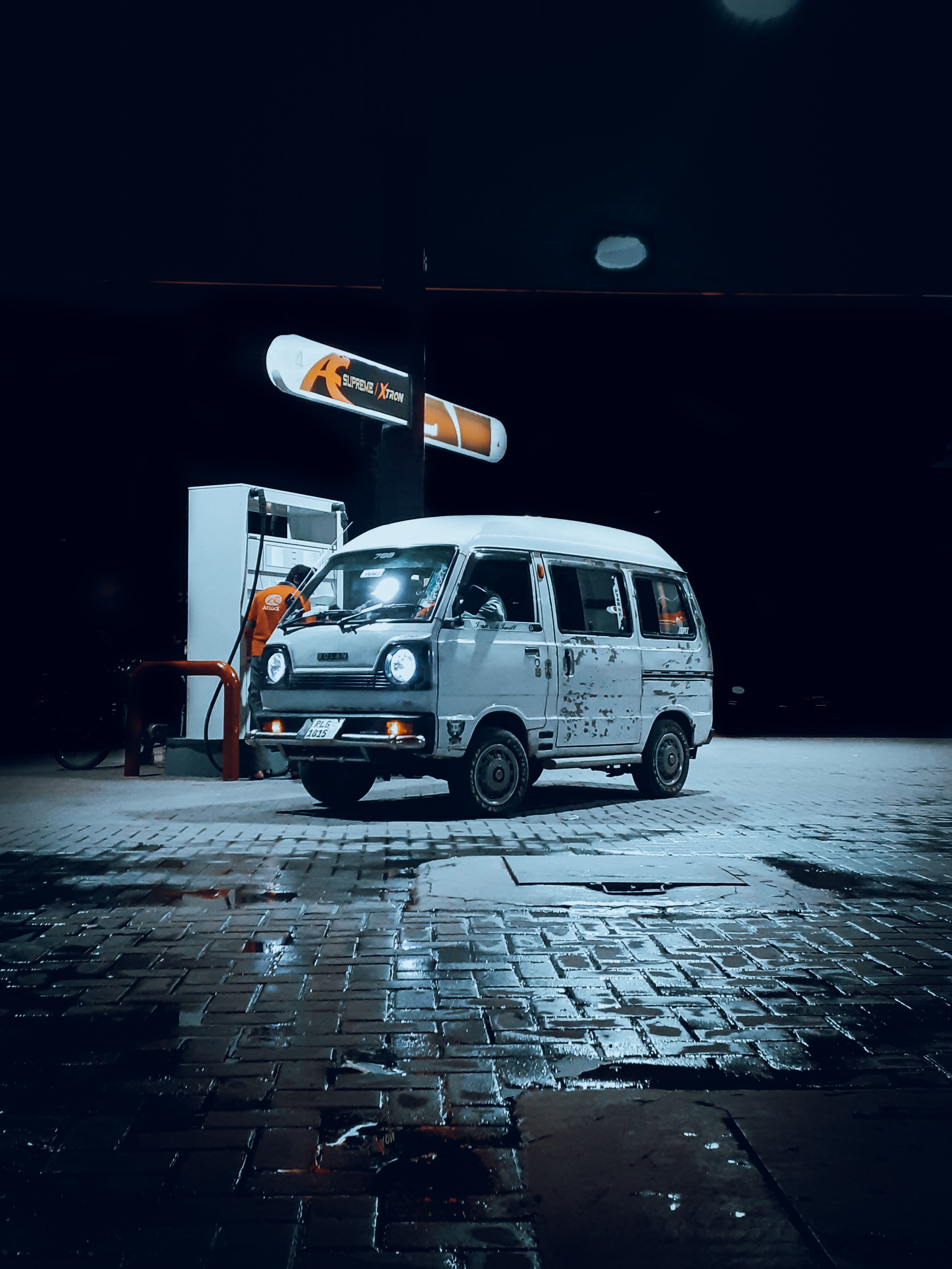 A Parked Mini Van in the Gasoline Station · Free Stock Photo