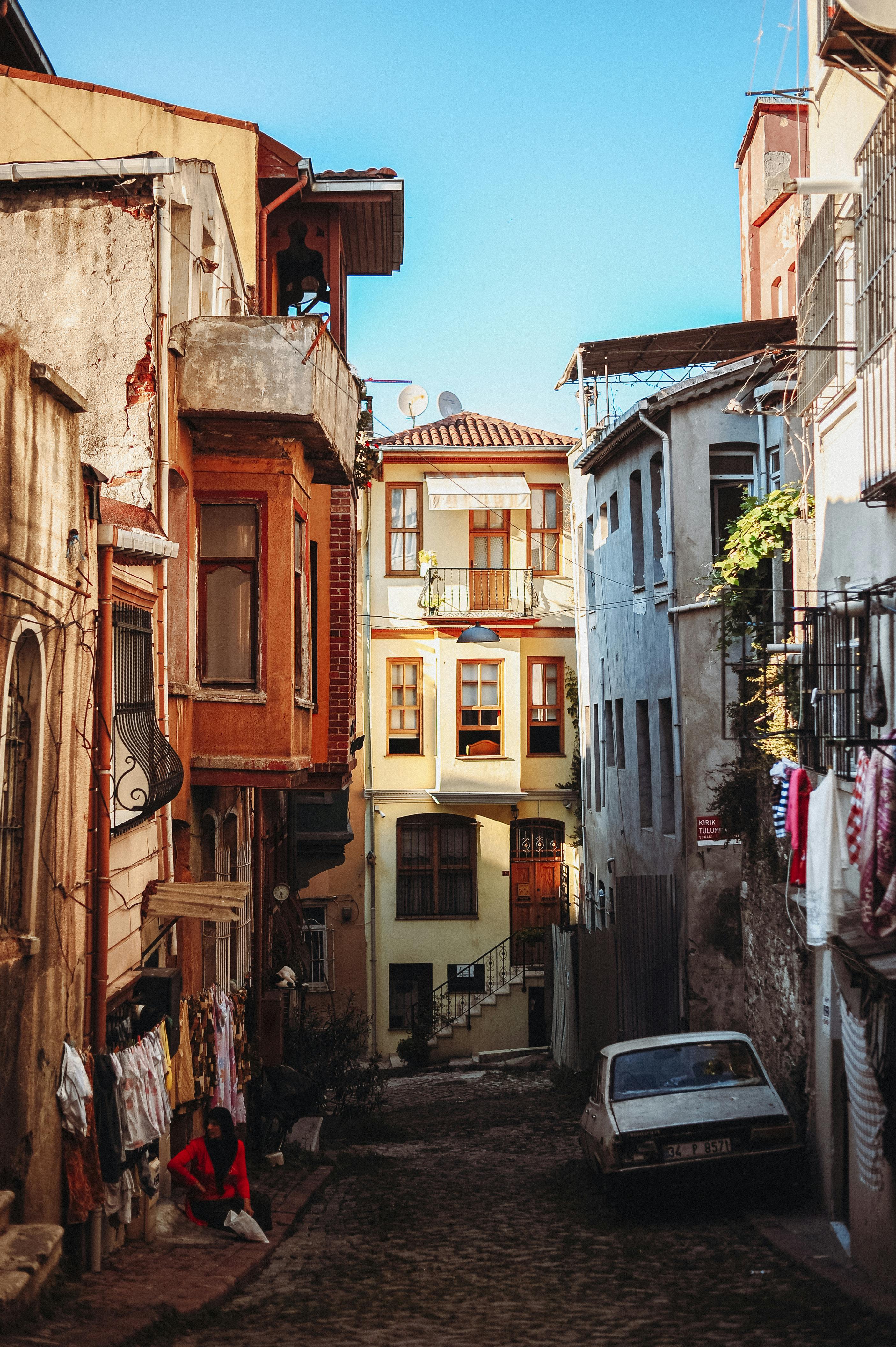 Narrow Street between Concrete Buildings · Free Stock Photo